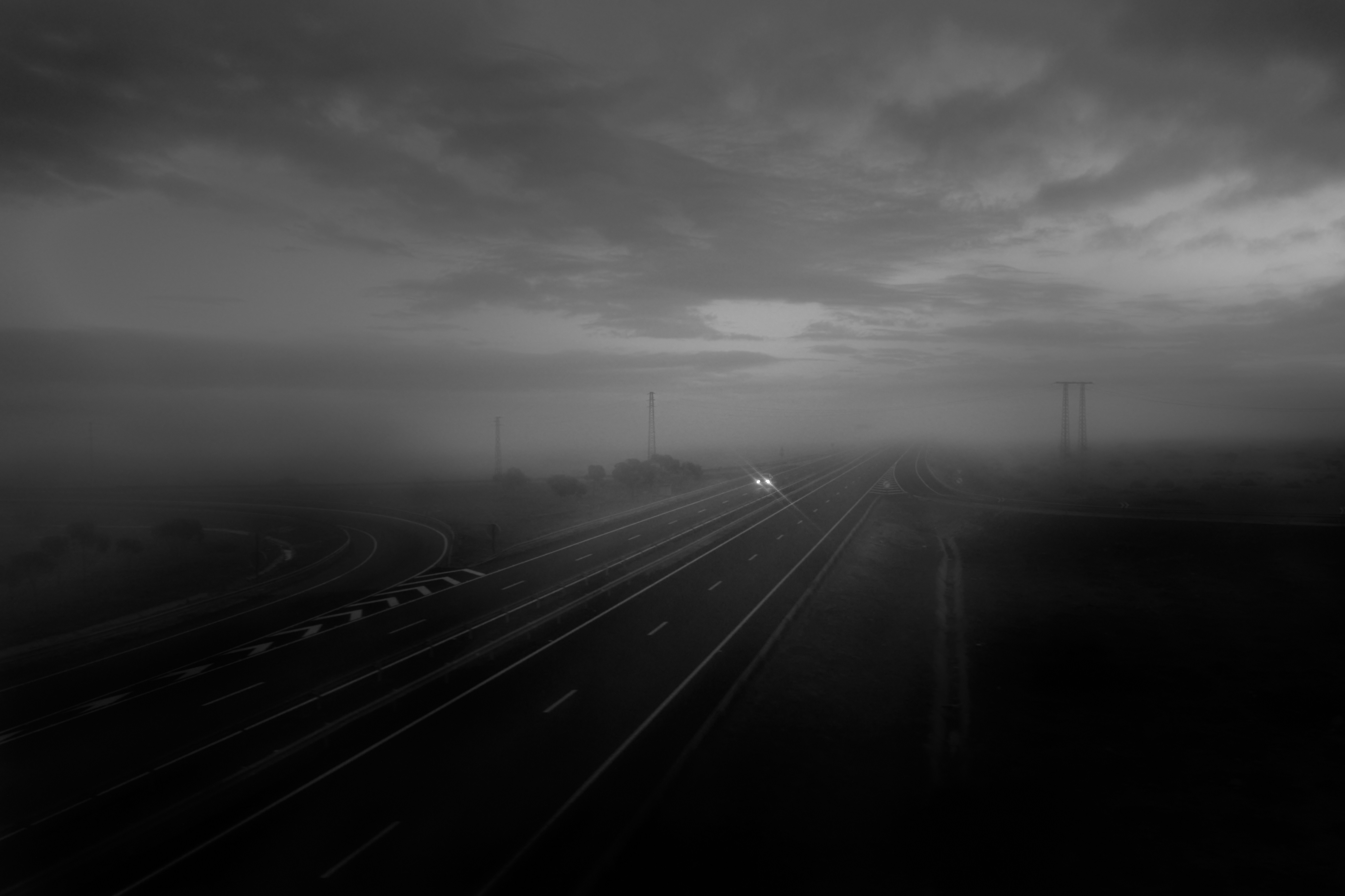 Low-Cloud Highway: Veiled Rail at Dusk