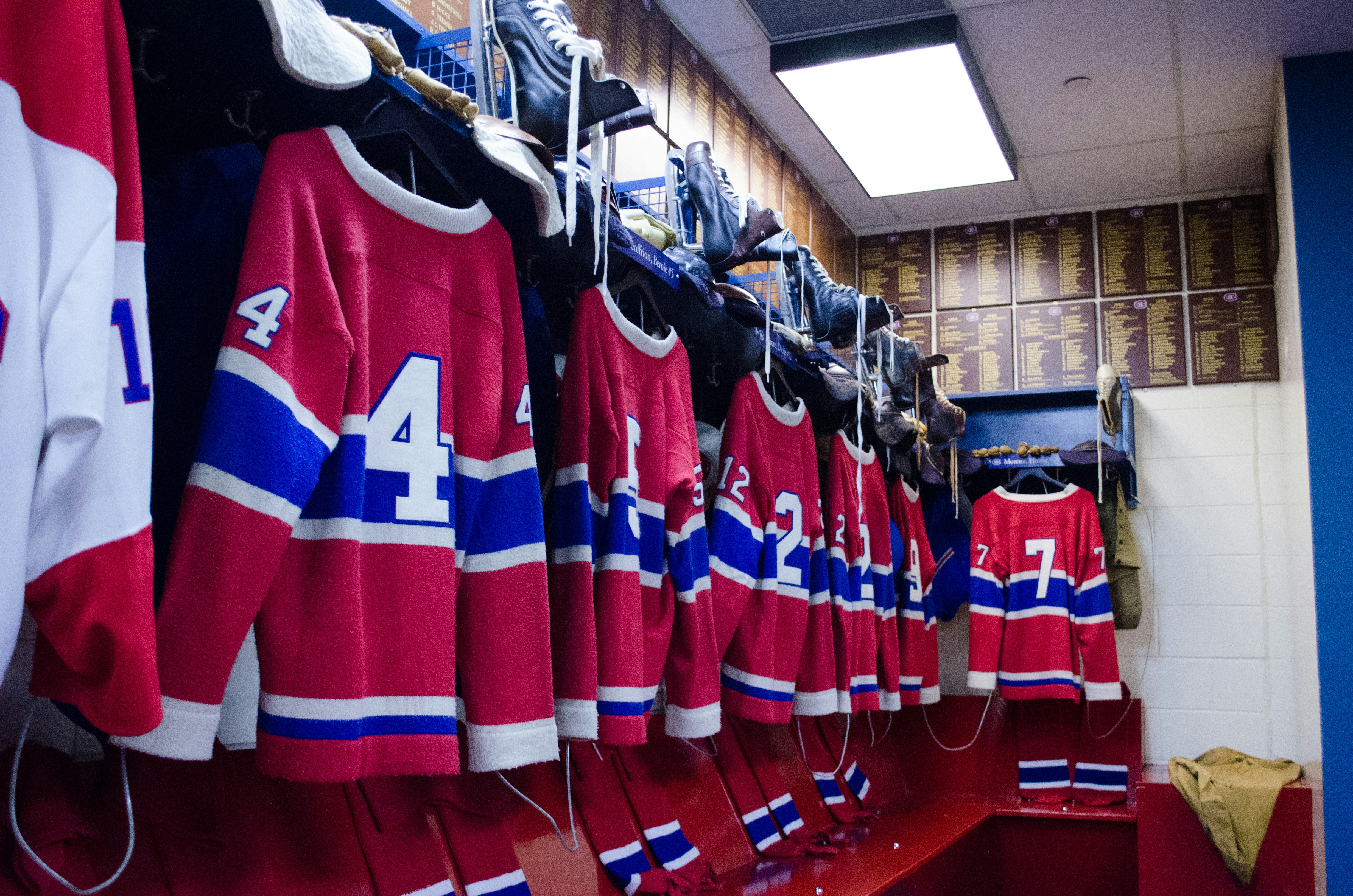 Line of Red Jerseys: A Quiet Locker Row in Focus