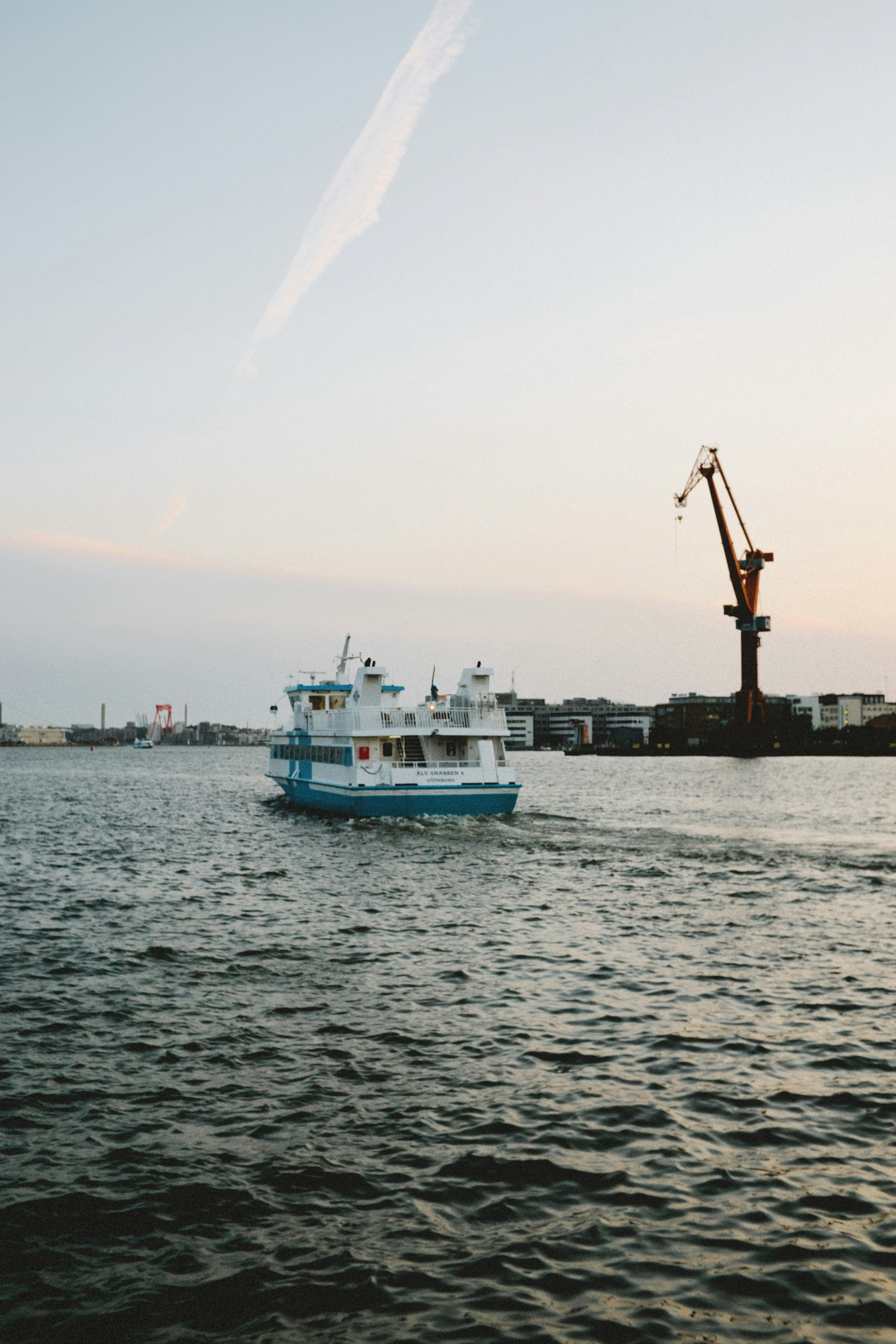Harbor Ferry at Dusk: A Quiet Confluence of Water and Crane