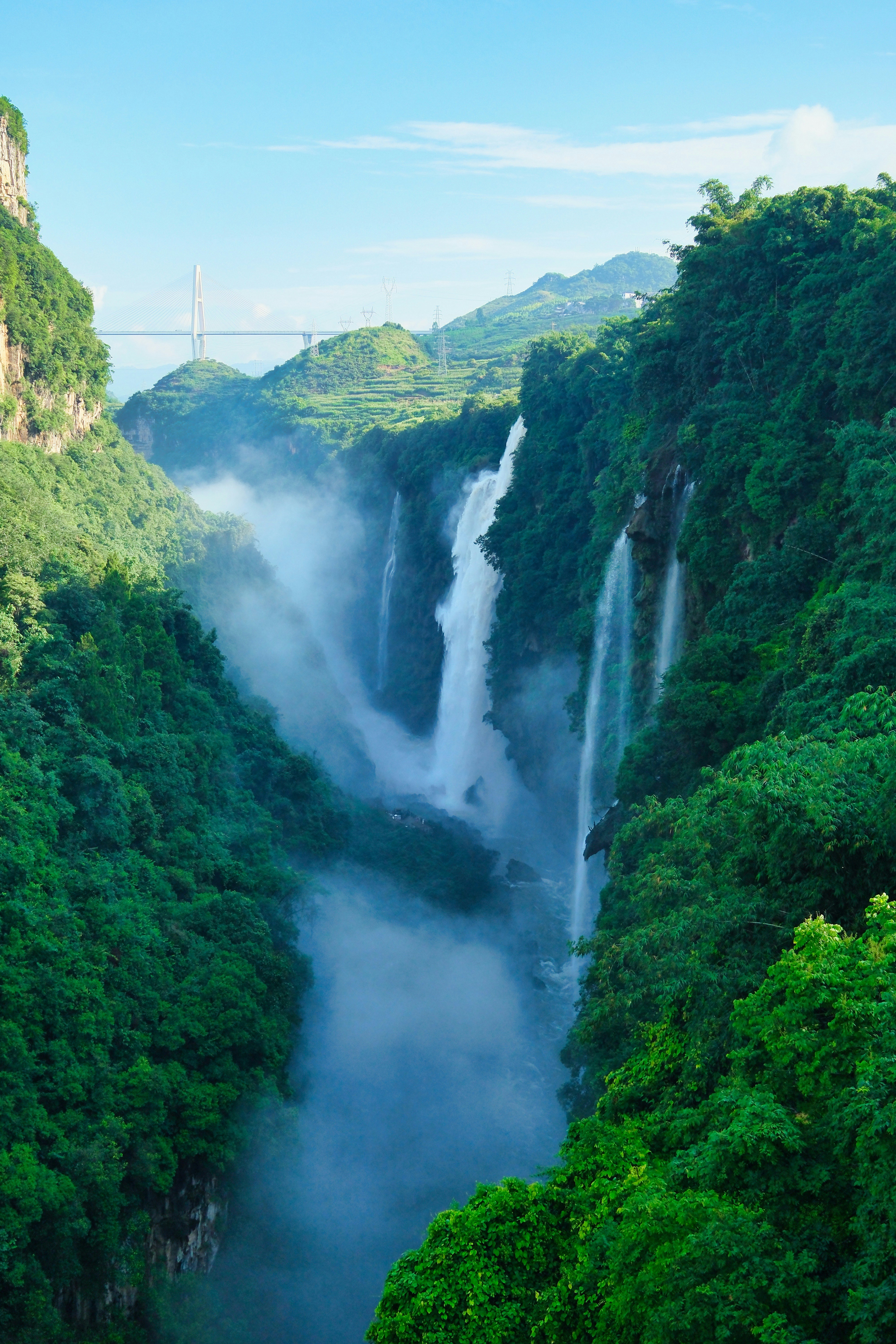 Embers of Mist: A Valley's Veil Over the Fall