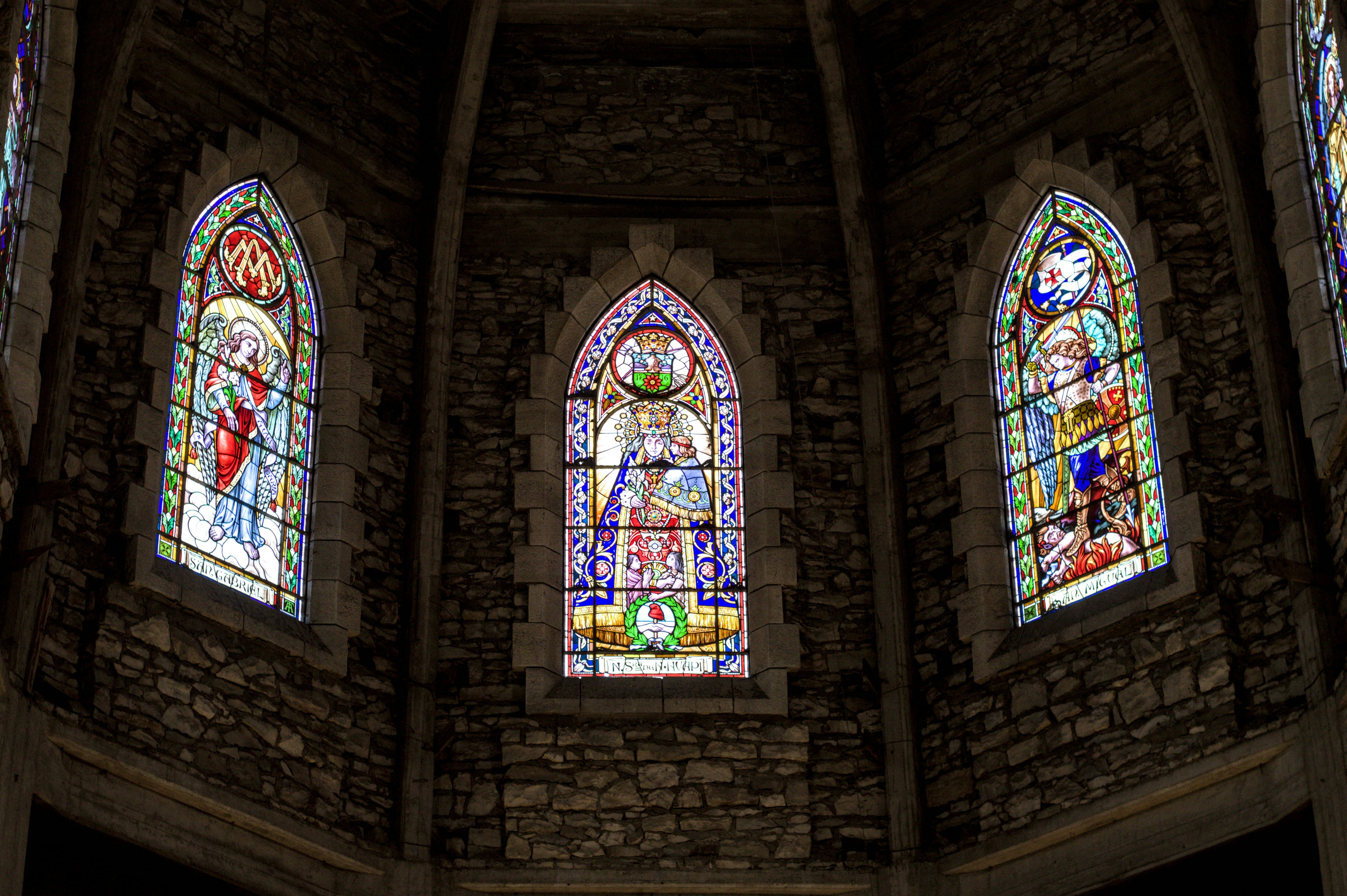 Midnight Nave: Stained Glass Trio in Stone Cathedral