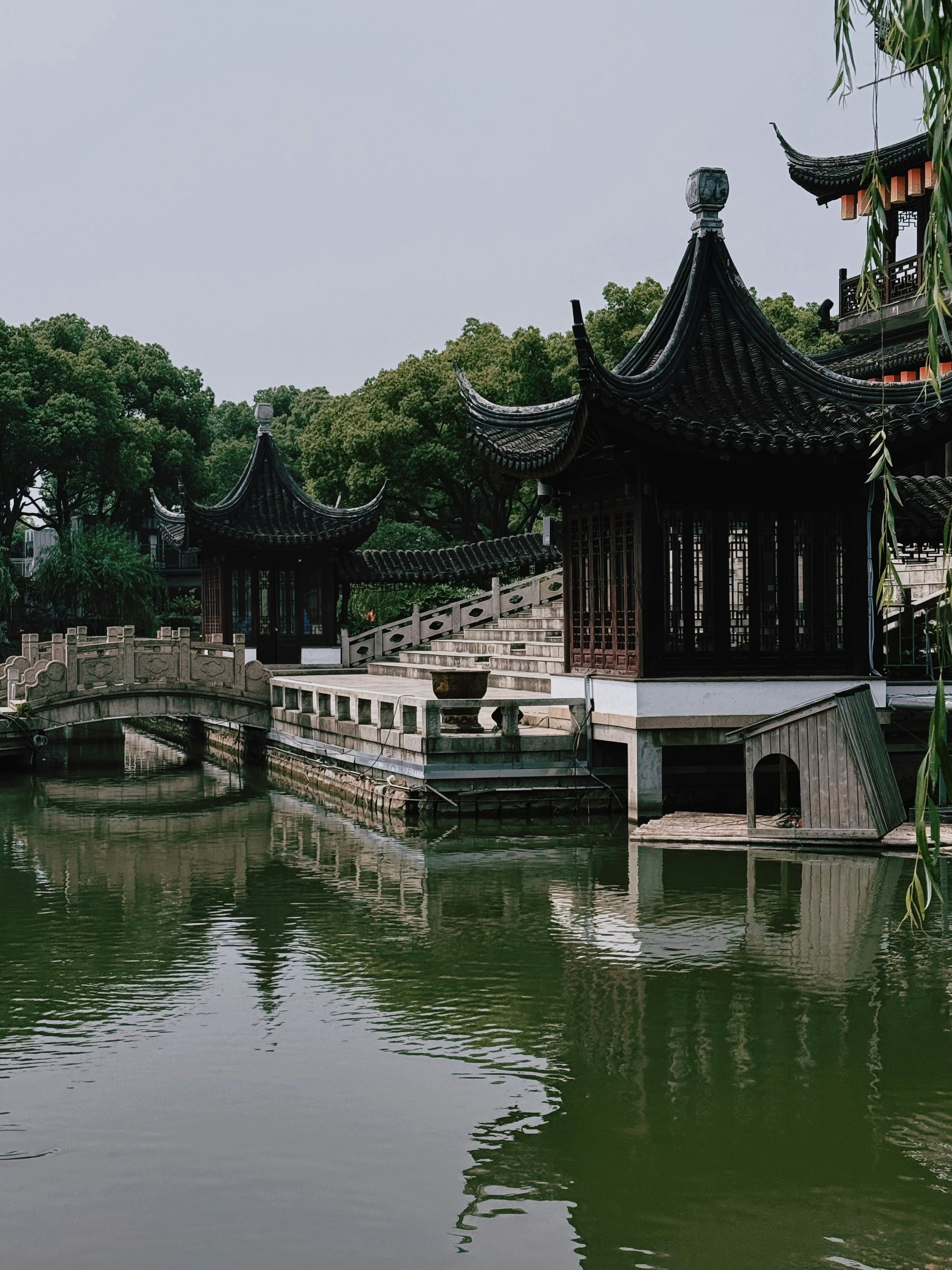 Serene Chinese Pavilion Reflections Over A Tranquil Canal