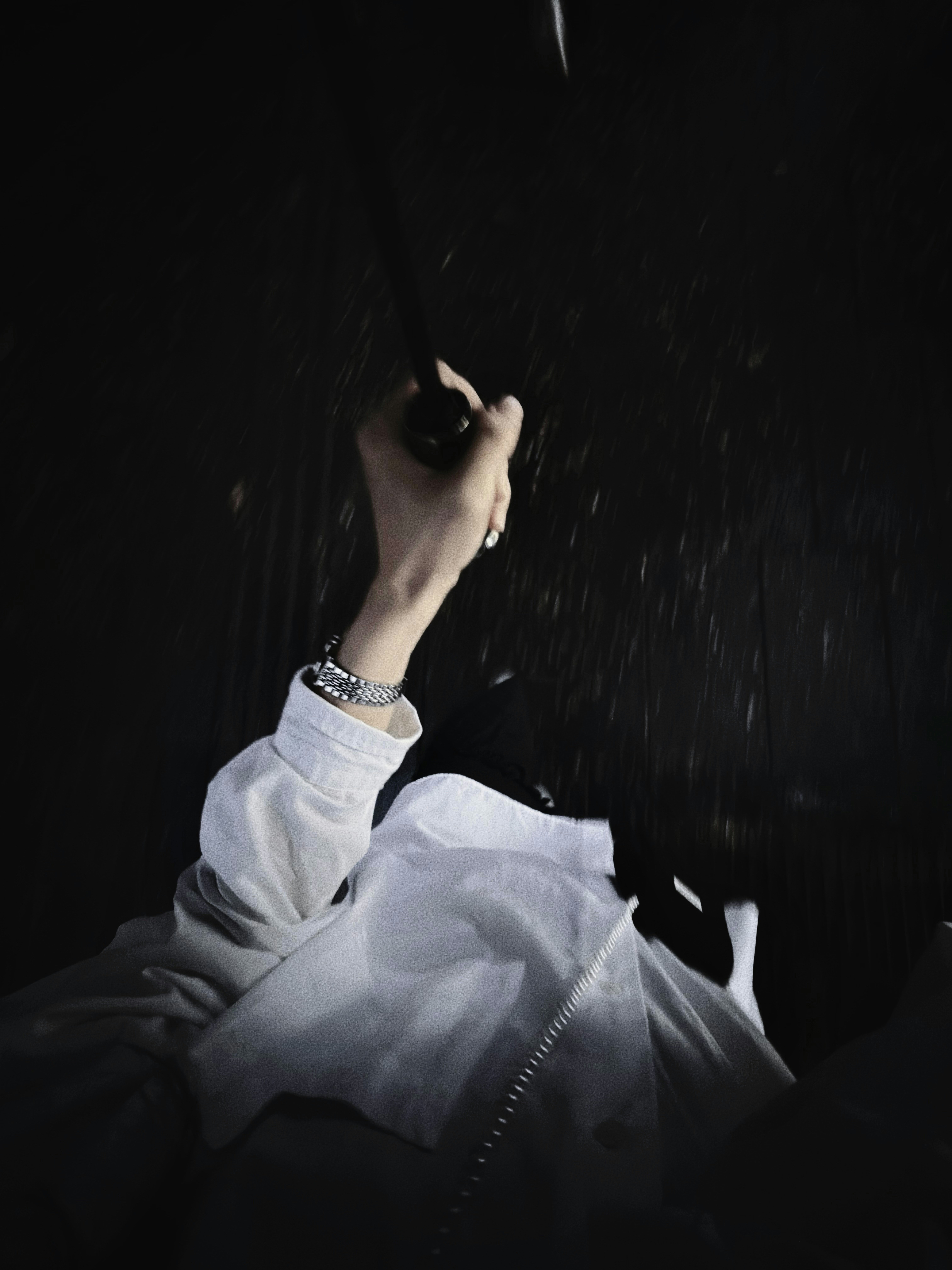 Caught in the Grip of Night: A Hand with a Knife in a Dark Frame