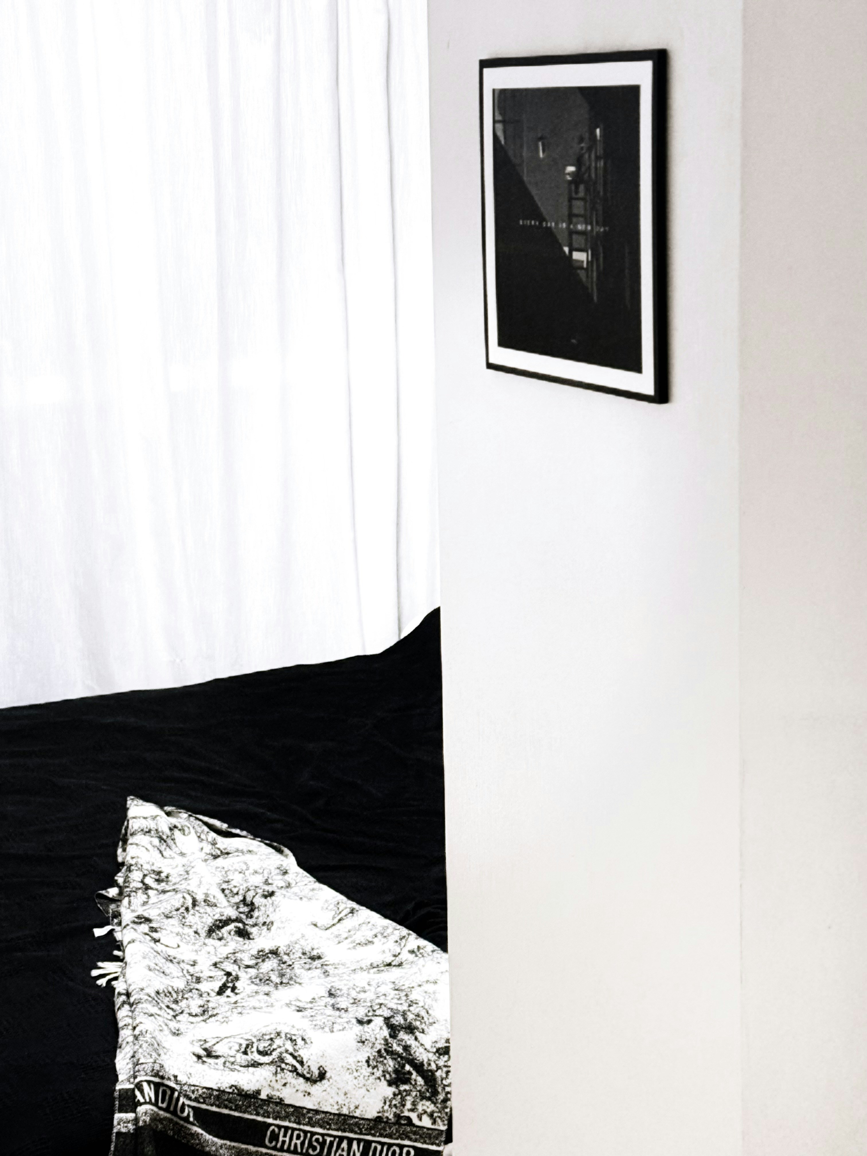 Monochrome Corner: A Cornered Portrait of Wall and Bedside Frame