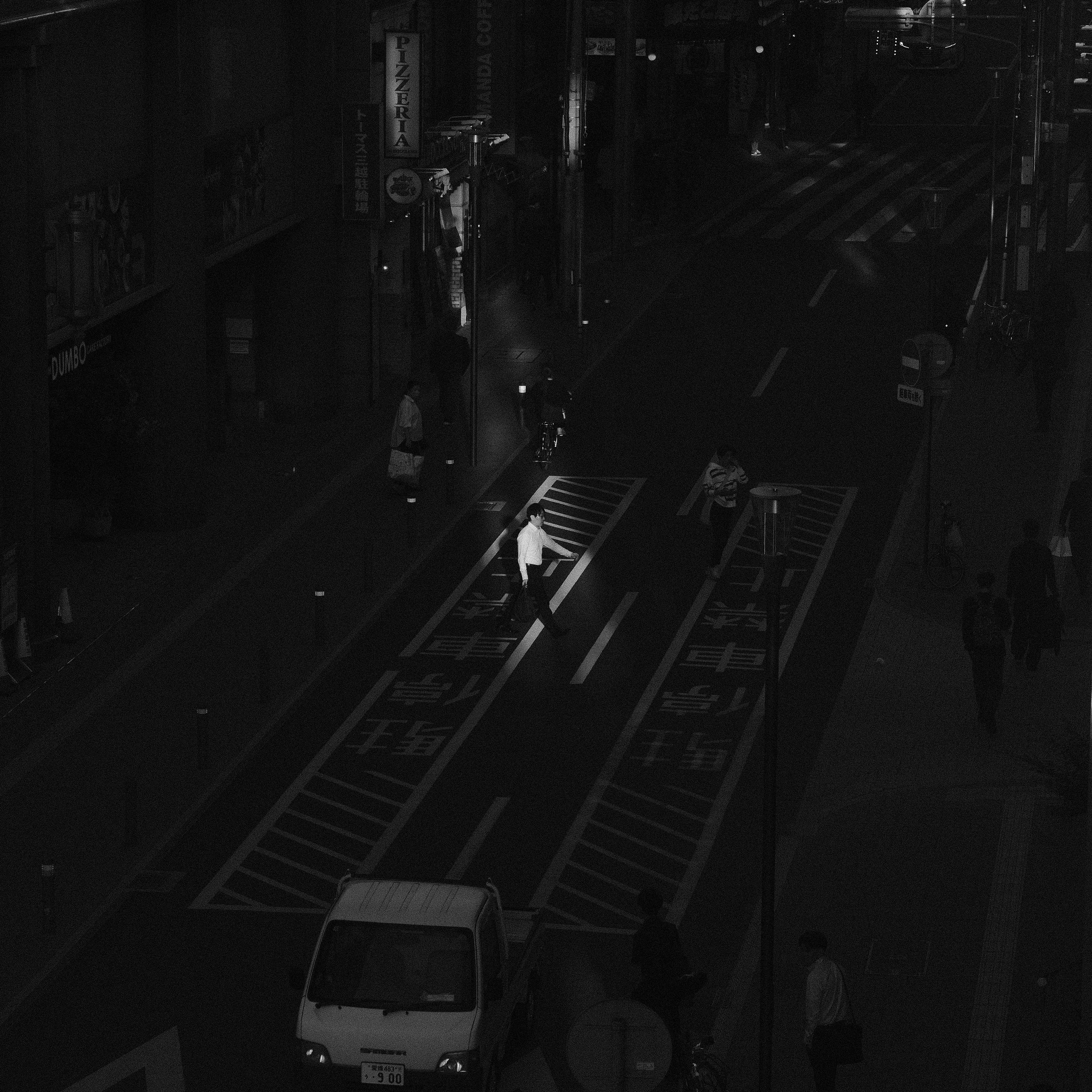 Night Pedestrian Crossing: Quiet Vigil Along a Dim City Street