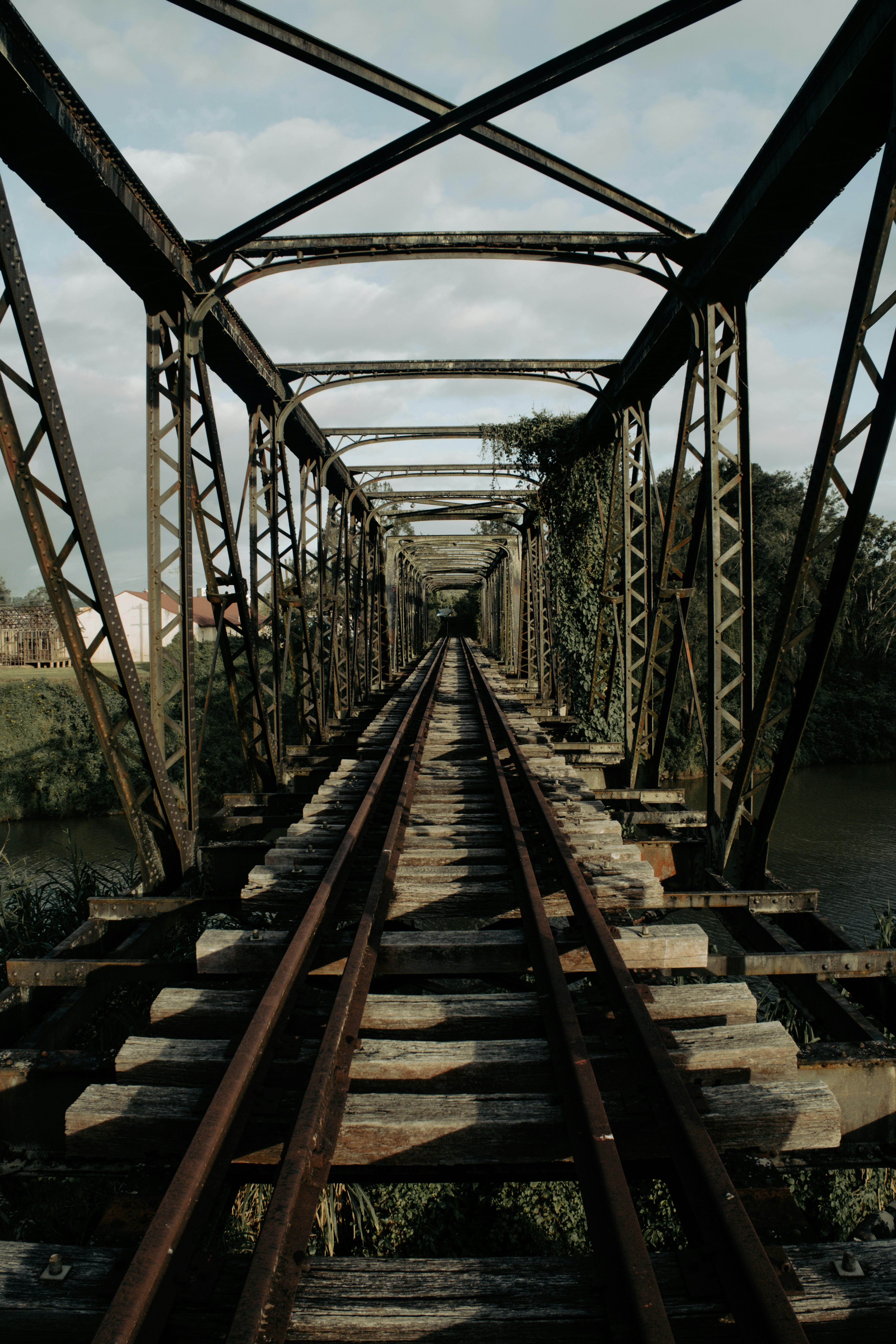 Iron Spine of the River Crossing: A Rails-to-Remains Structure Reaching the Horizon