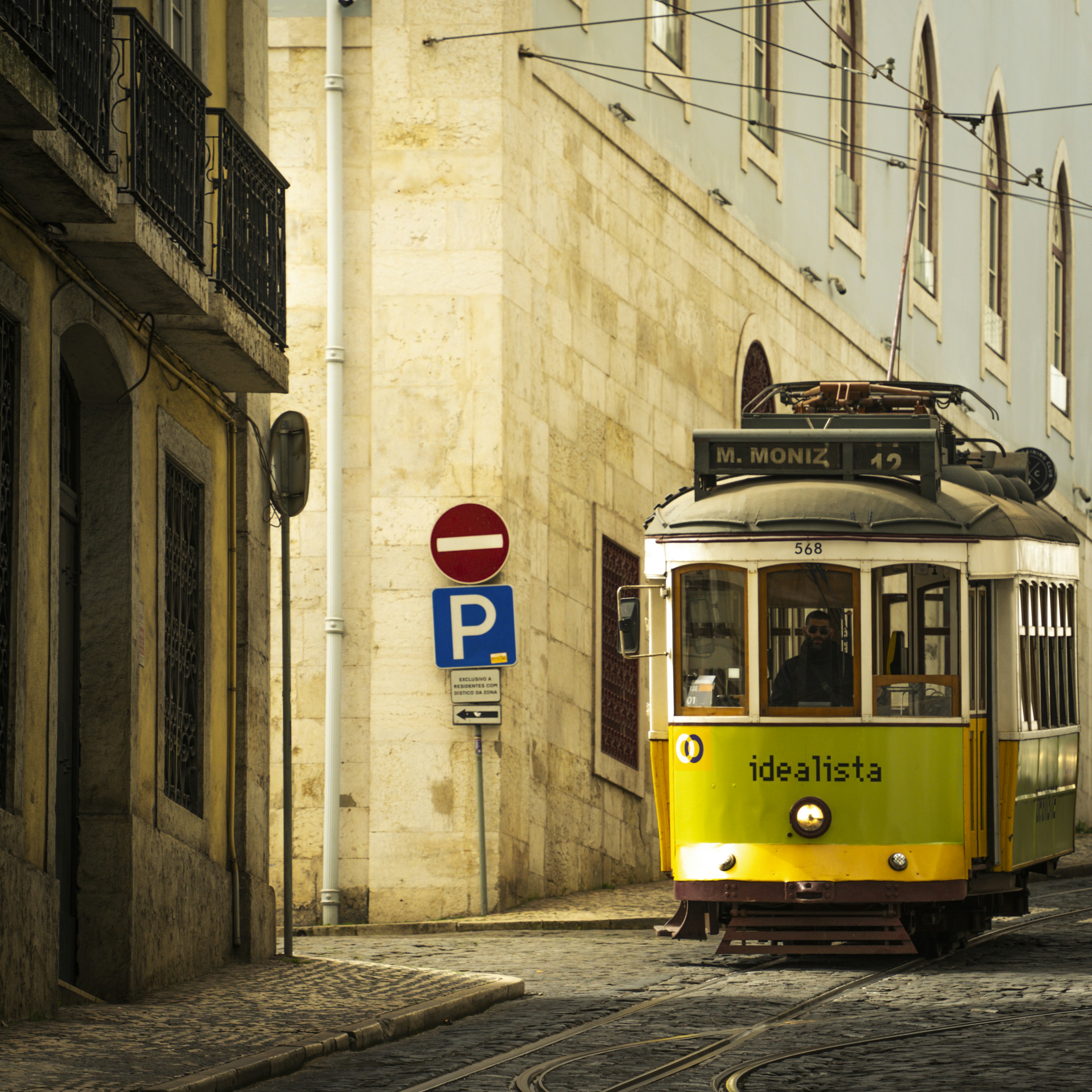 Yellow Tram Rounds the Corner: A Quiet Streetcar Moment
