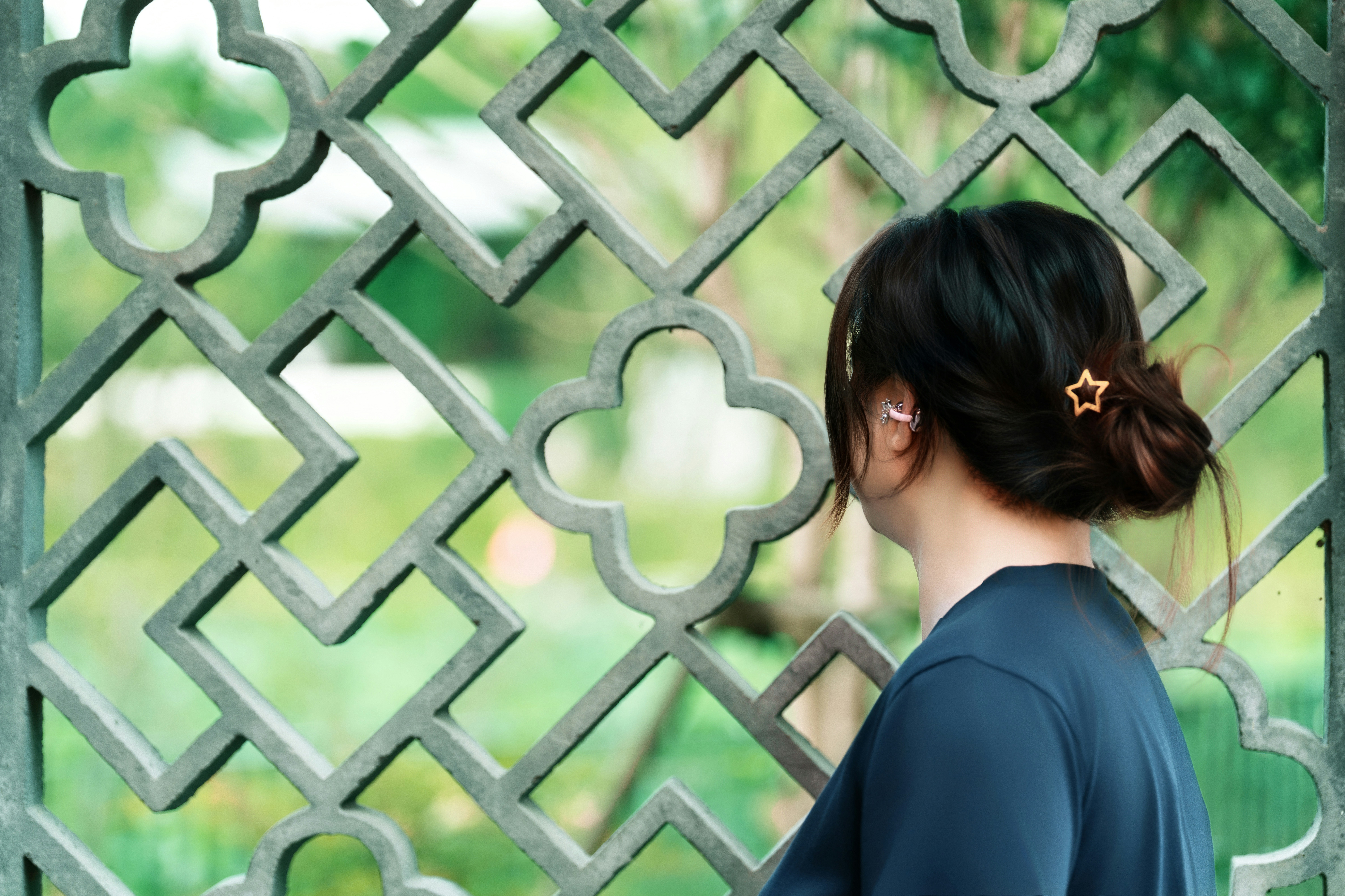 Portrait Through a Patterned Veil: A Silent Turn