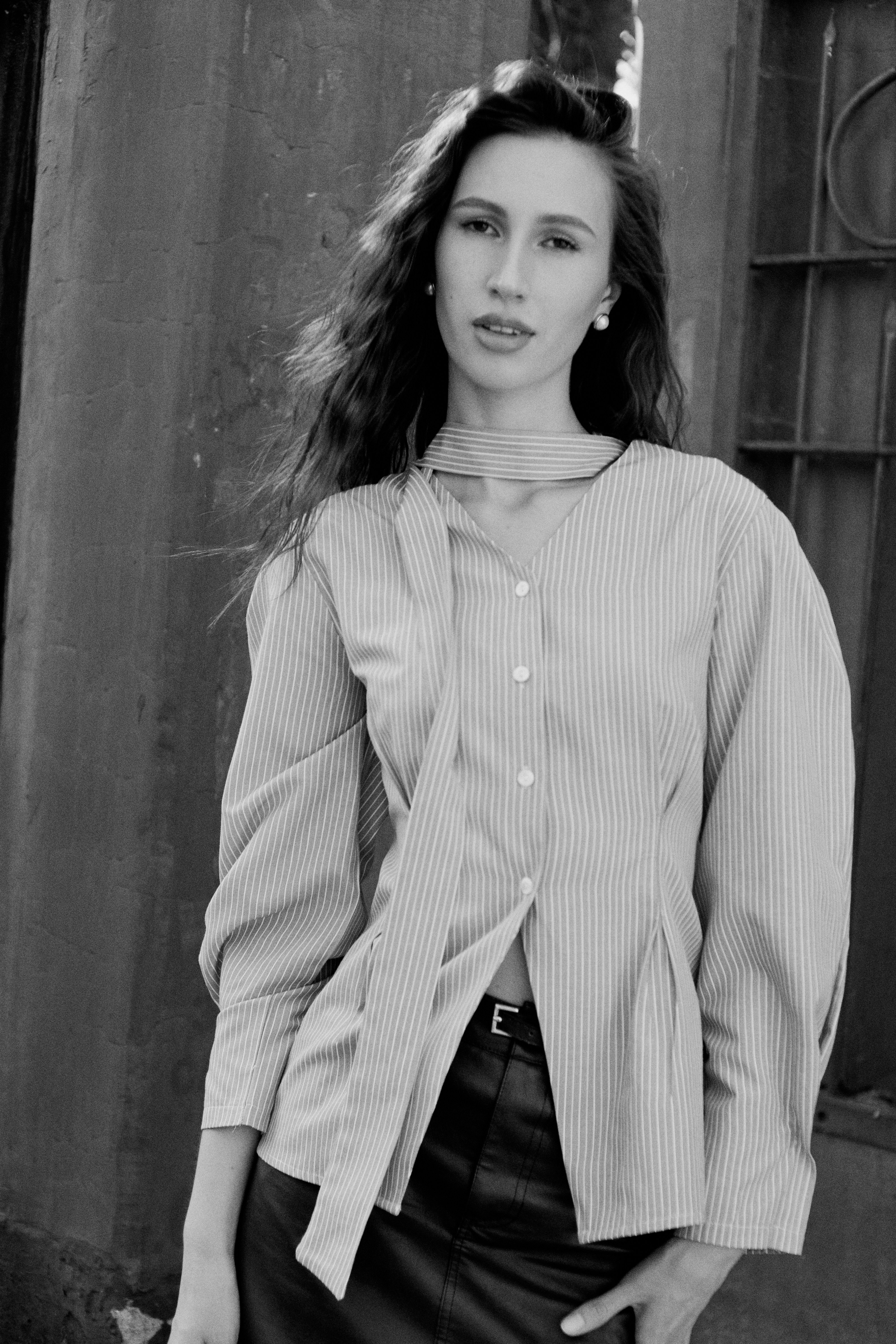 Portrait in Mono: A Confident Gaze Through Urban Steel