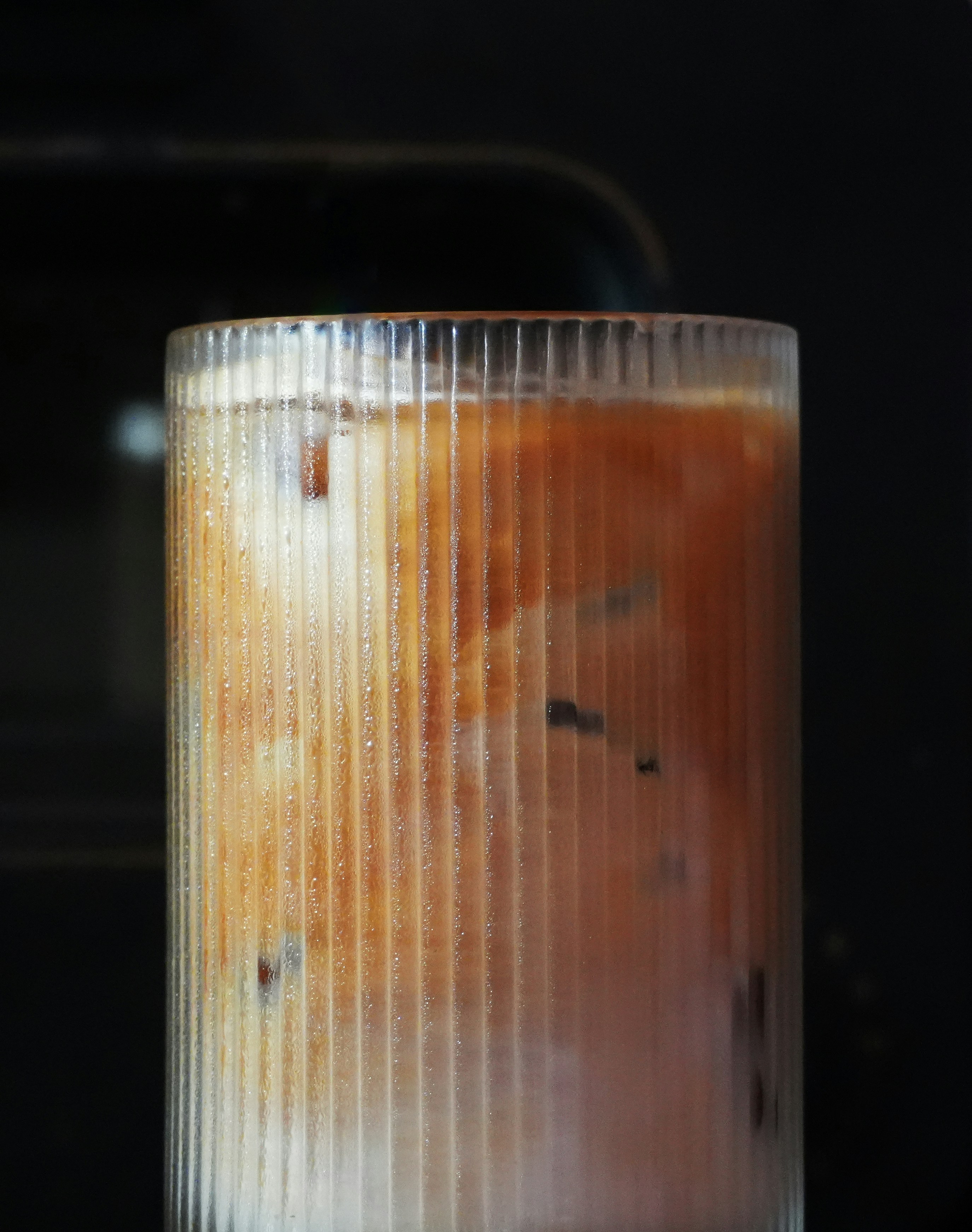 Ice-Cold Fizz Through Ribbed Glass