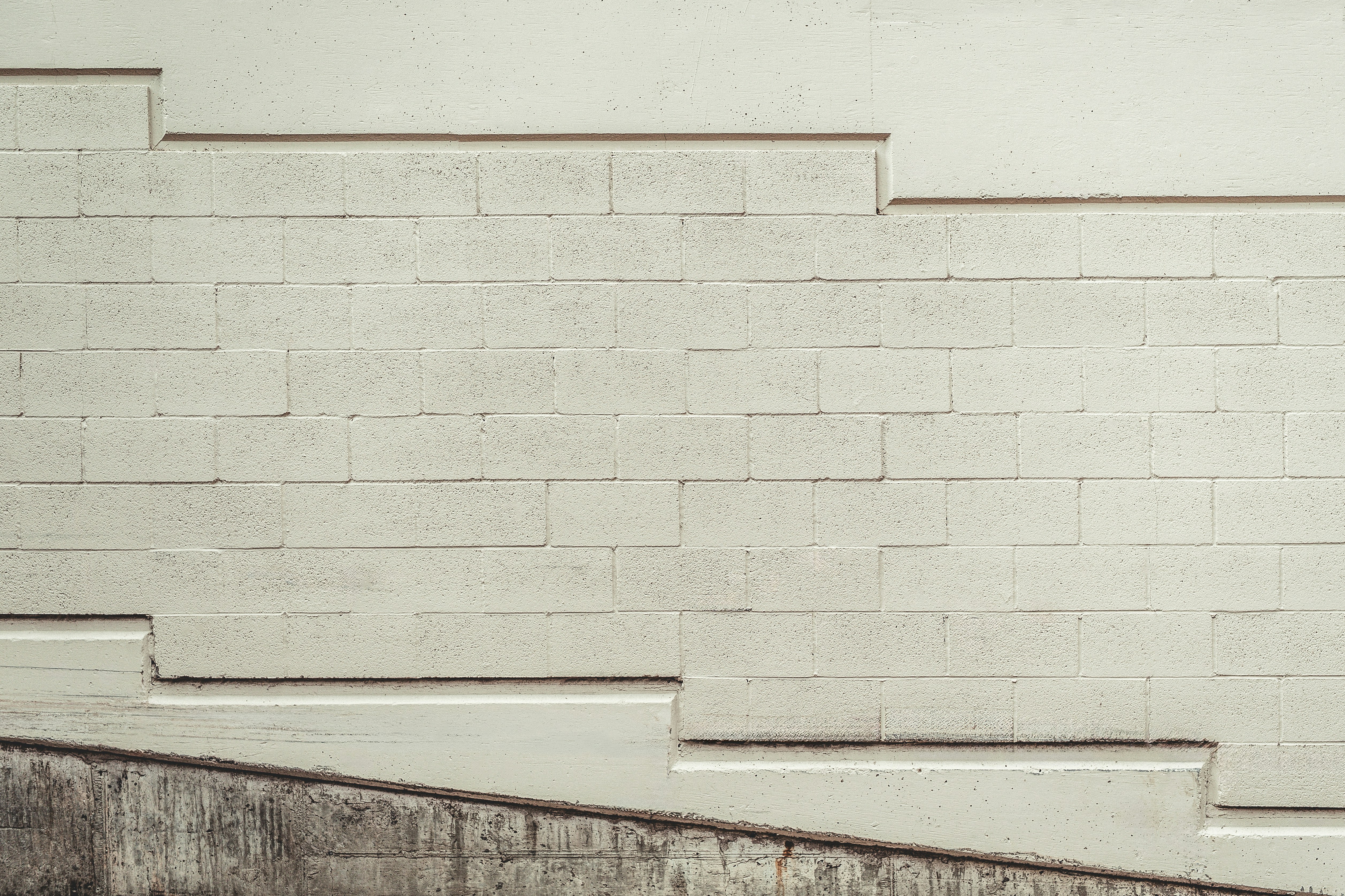 Muted Concrete Geometry: Stair Steps Along a Plain Wall