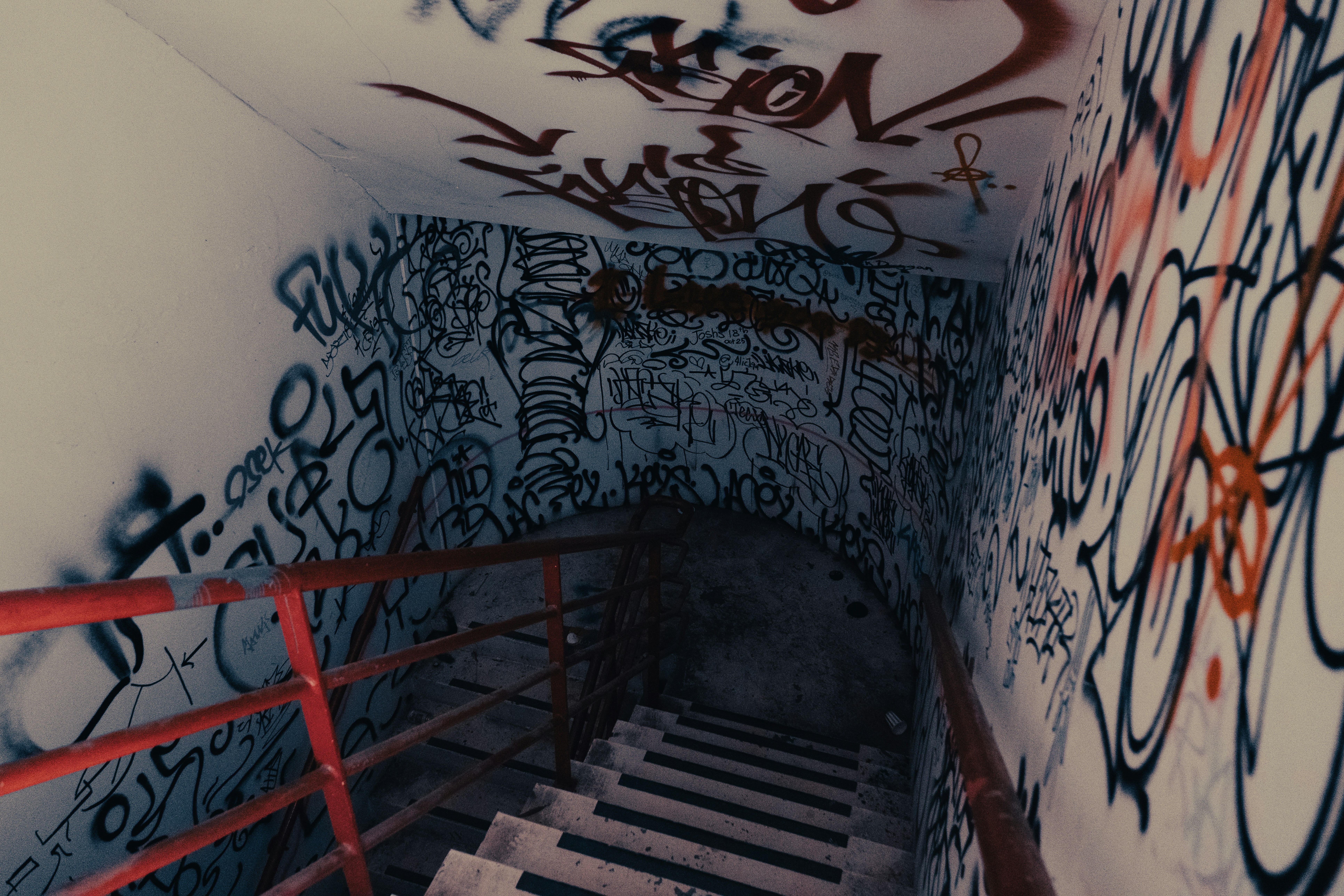 Graffitied Descent: The Whispering Stairwell