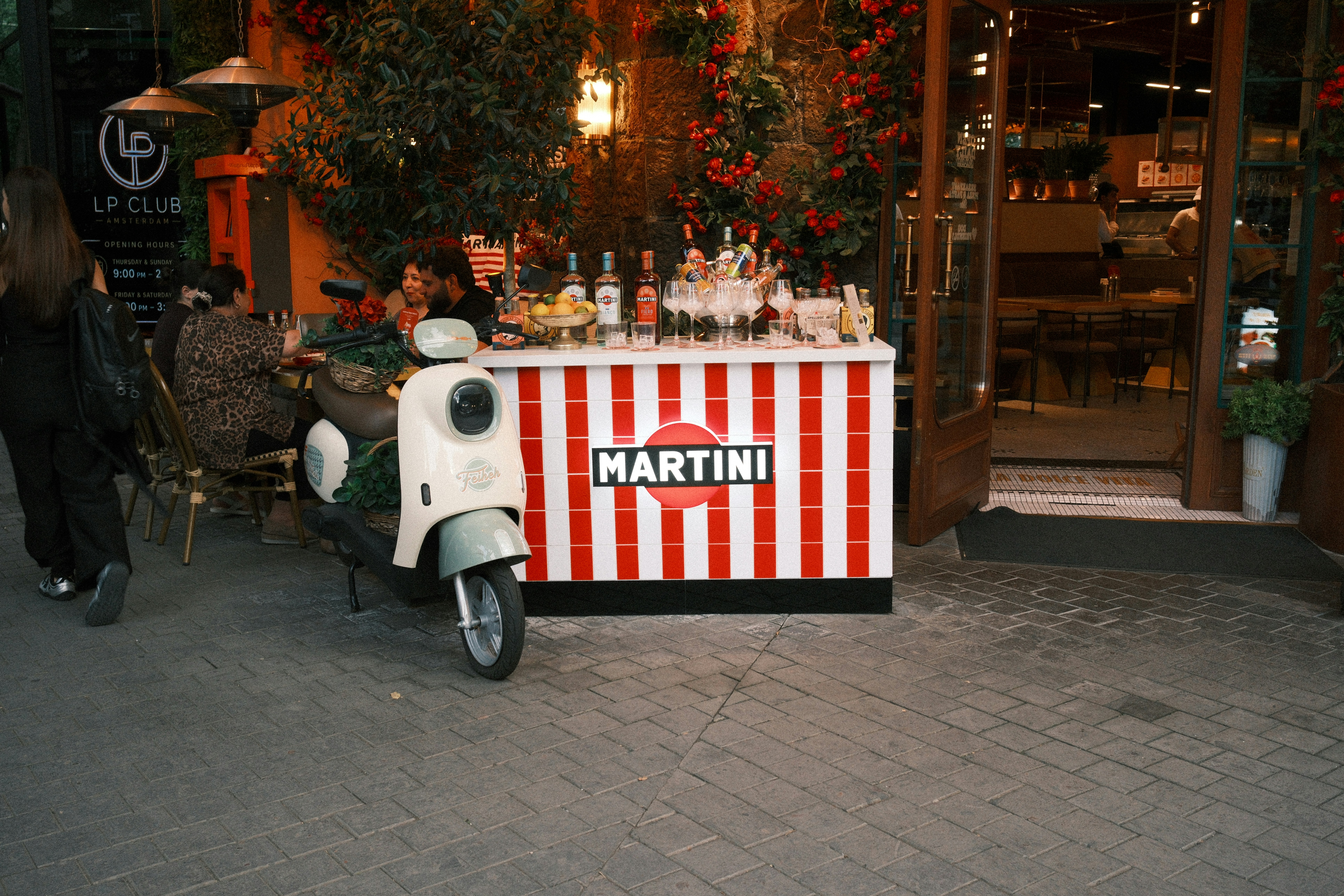 Martini Cart on Cobblestones: A Quiet Streetfront Café Moment