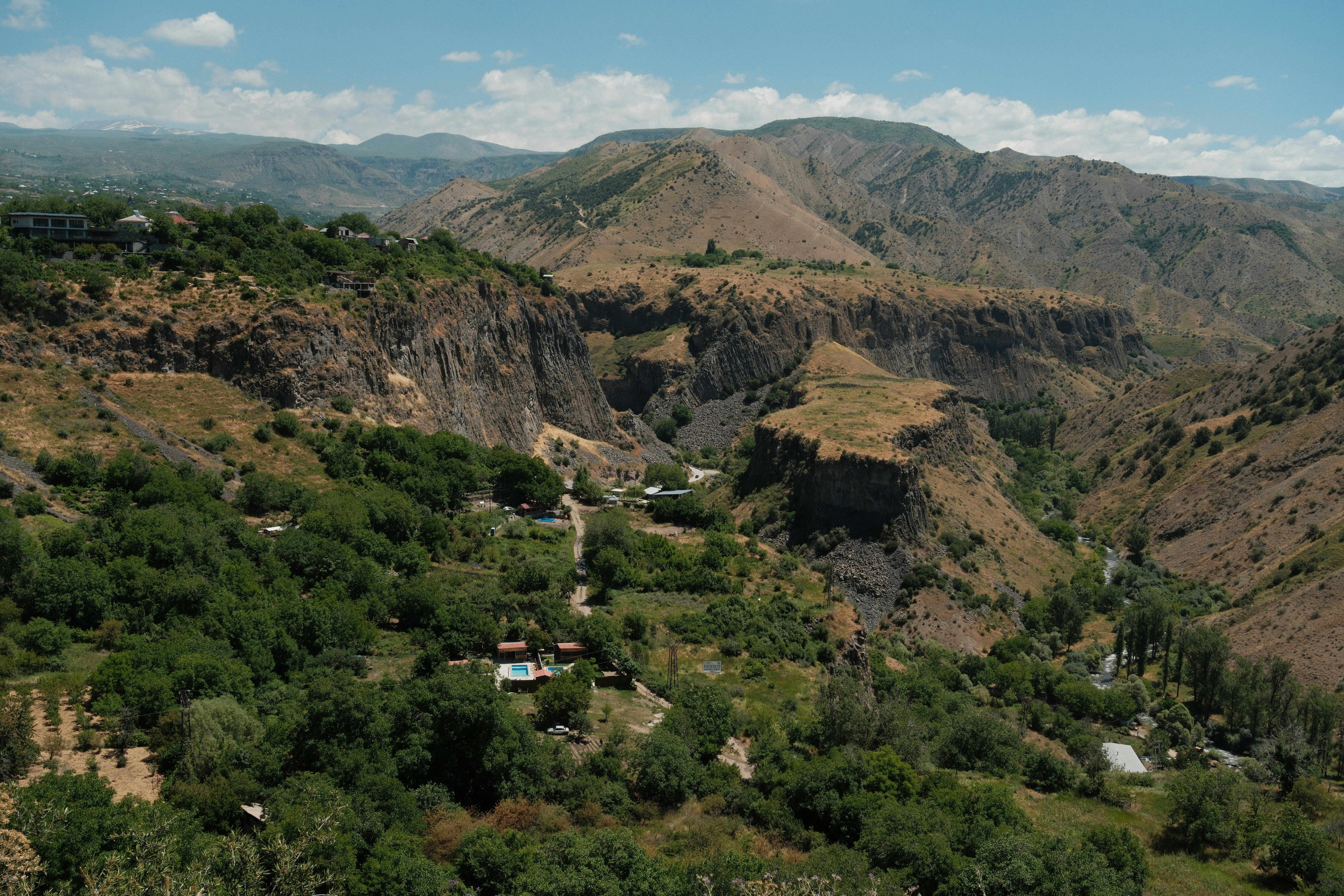 Terraced Canyon Village under a Clear Sky