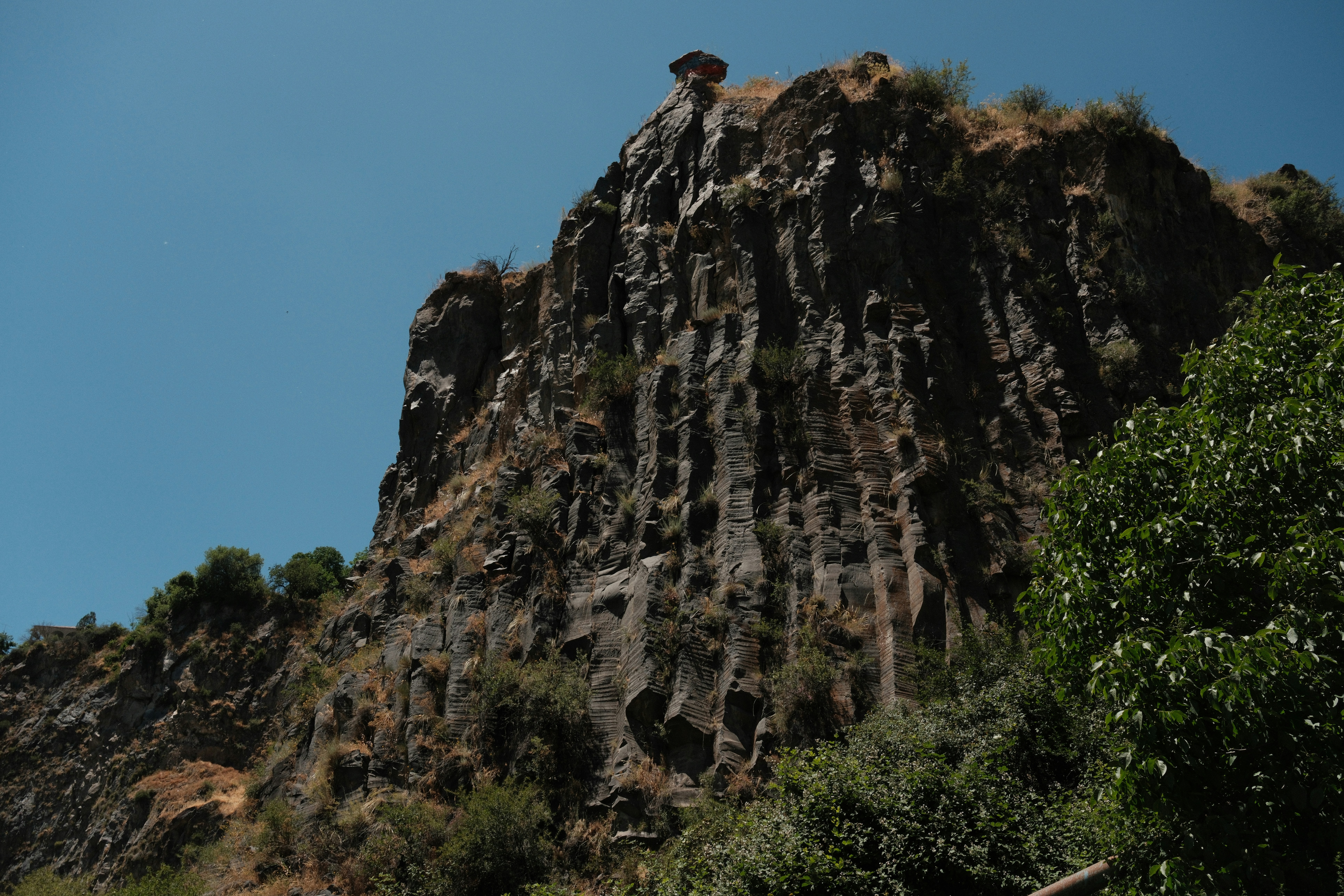 Cliff Sentinel: A Lone Ledge Crowns the Jagged Ridge