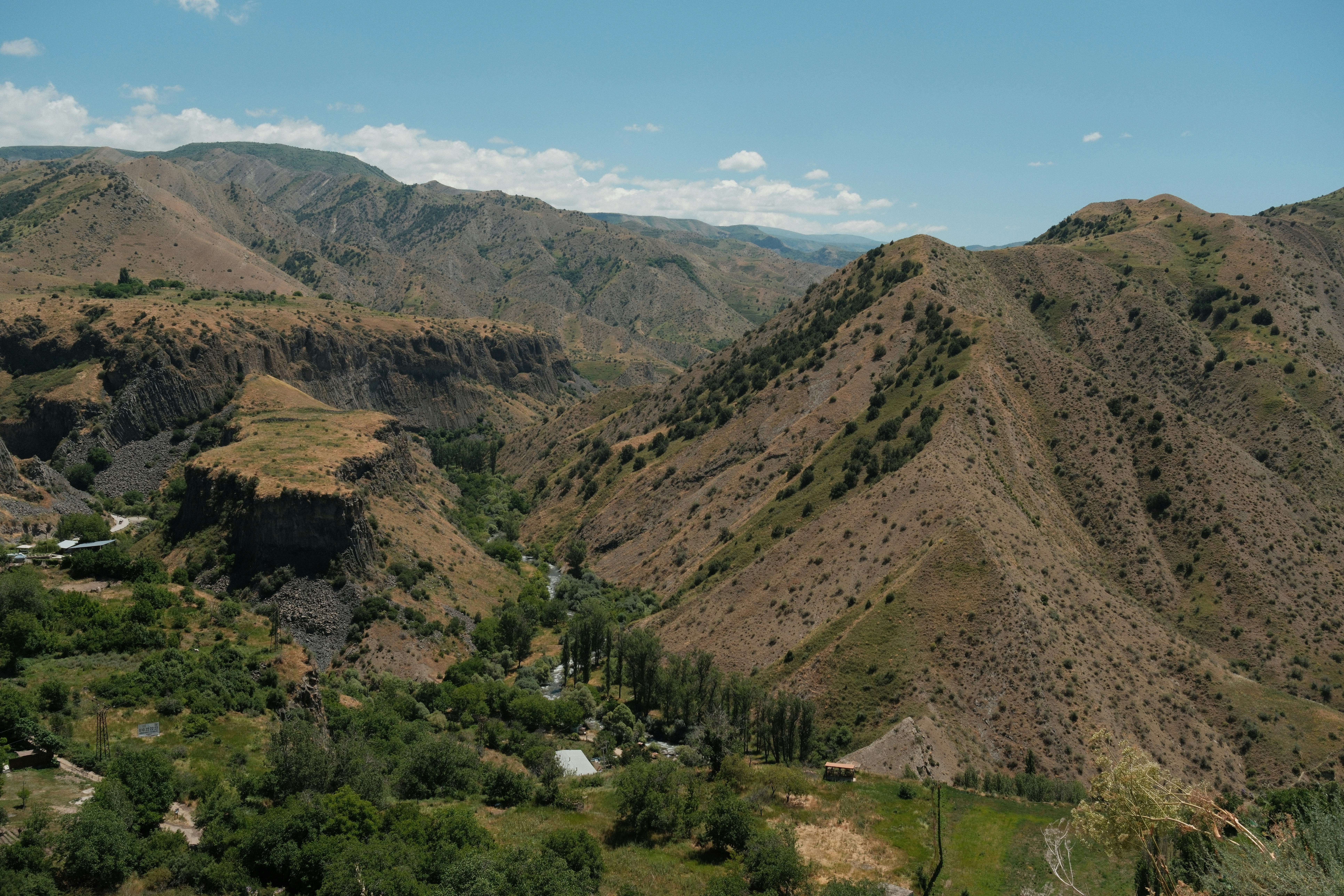 Ridge Line Overlook: Sunlit Valleys Among Desert Hills