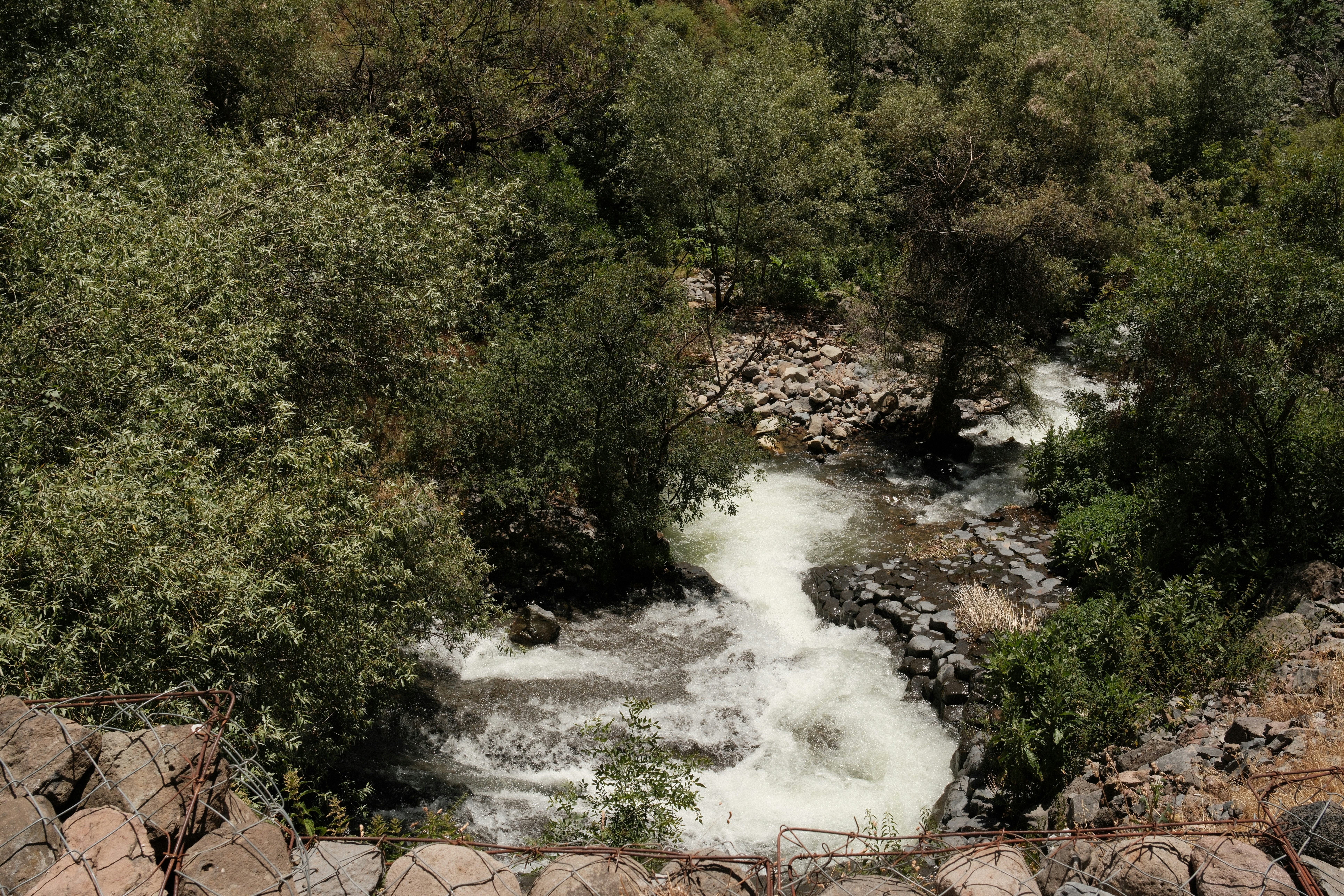 Rugged Cascade: A river carving through rocky banks