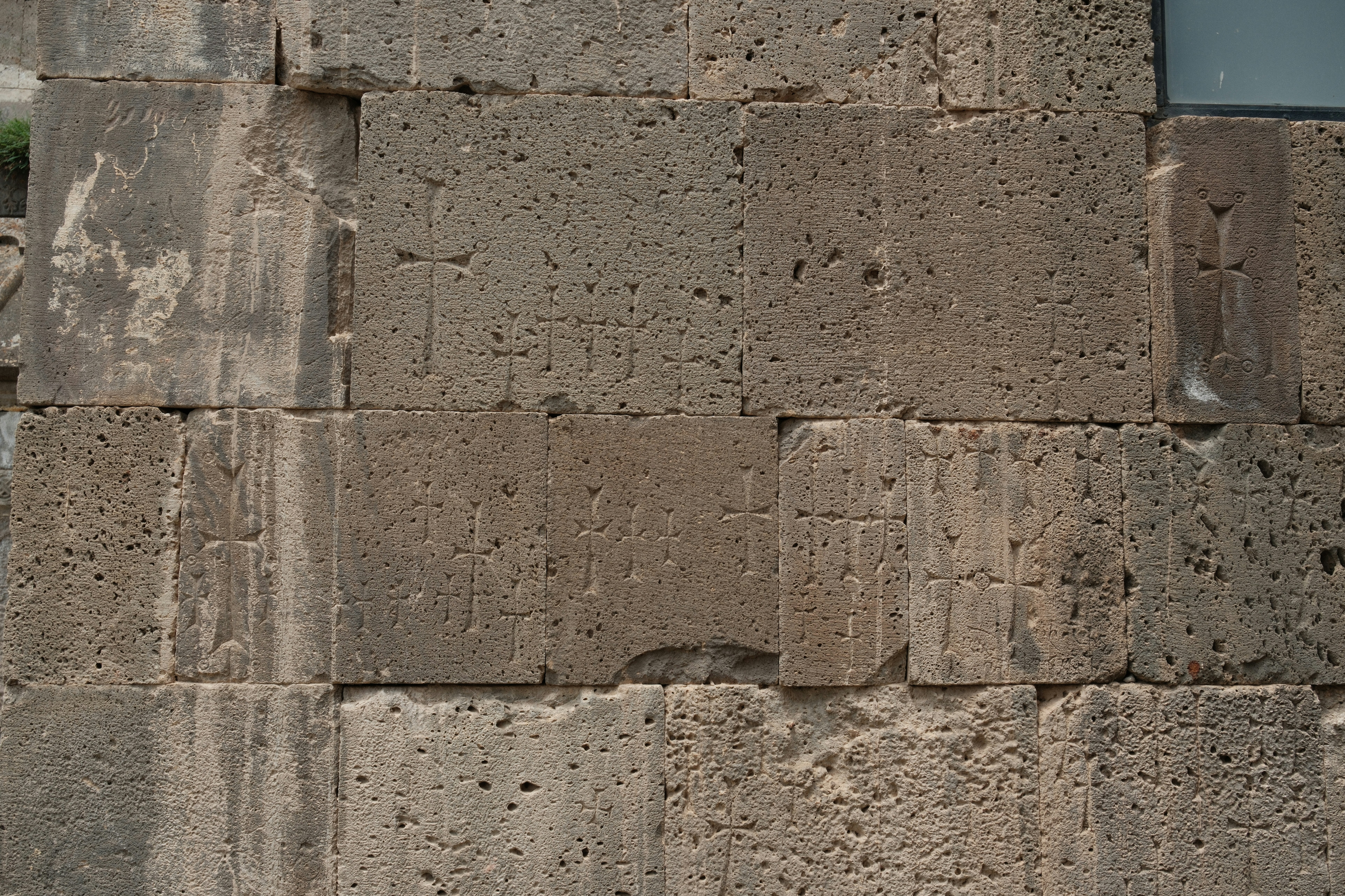 Weathered Blockwork: A Close Look at a Stone Wall's Texture and Patina