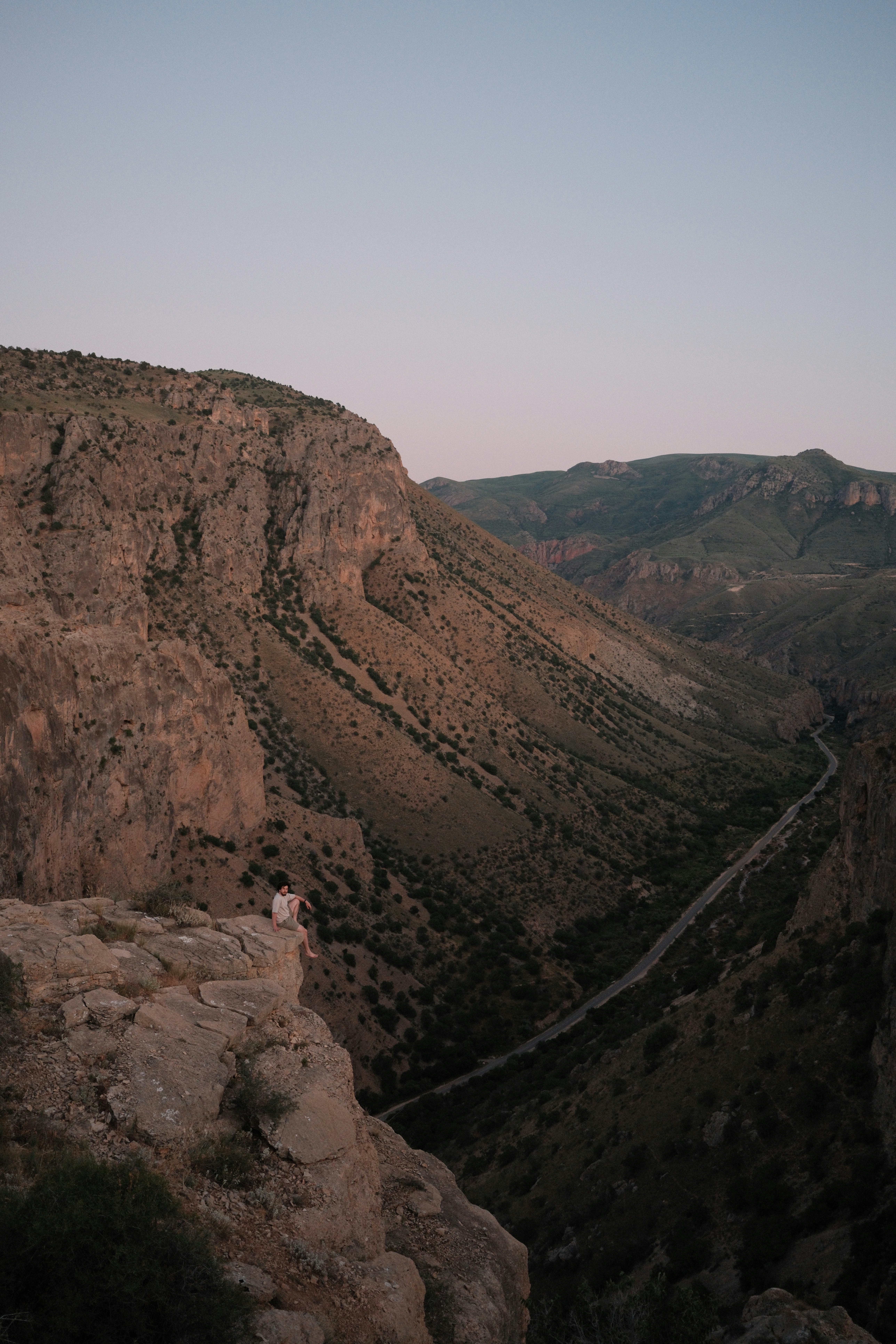 Edge of the Canyon: A lone hiker on the cliff