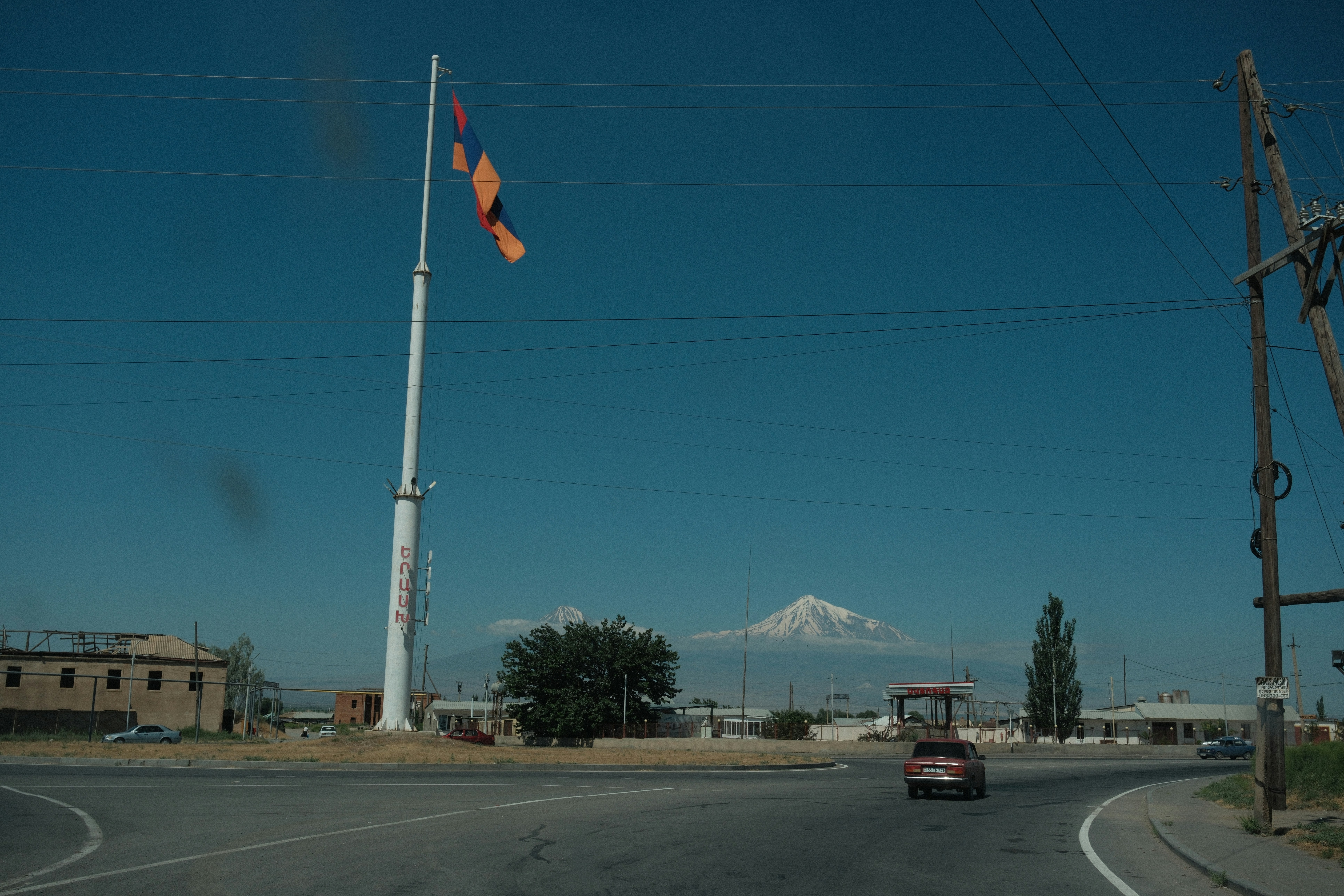 Desert Road Toward the Snow-Capped Peak