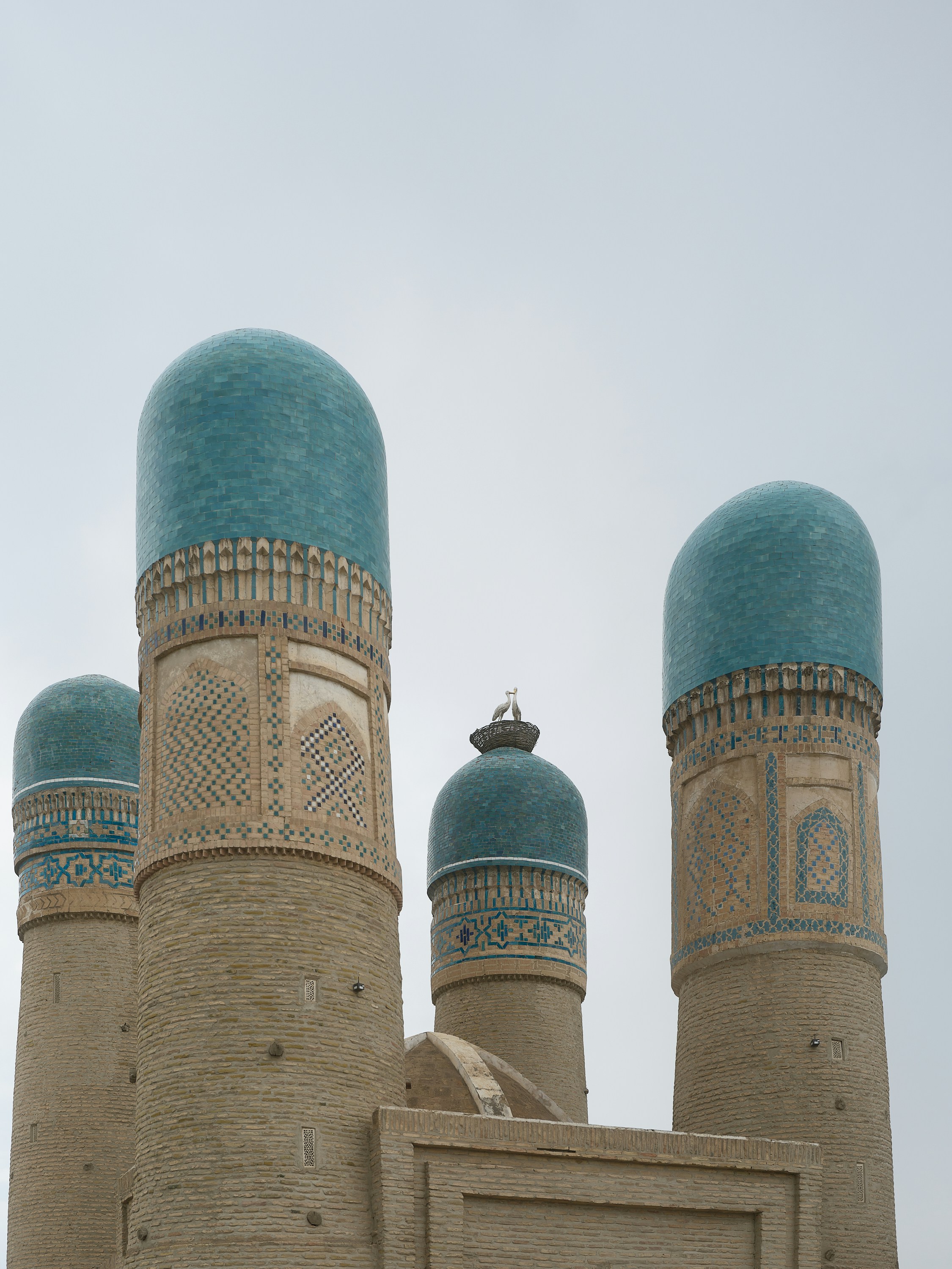 Desert towers rise: turquoise domes crown ancient brickwork