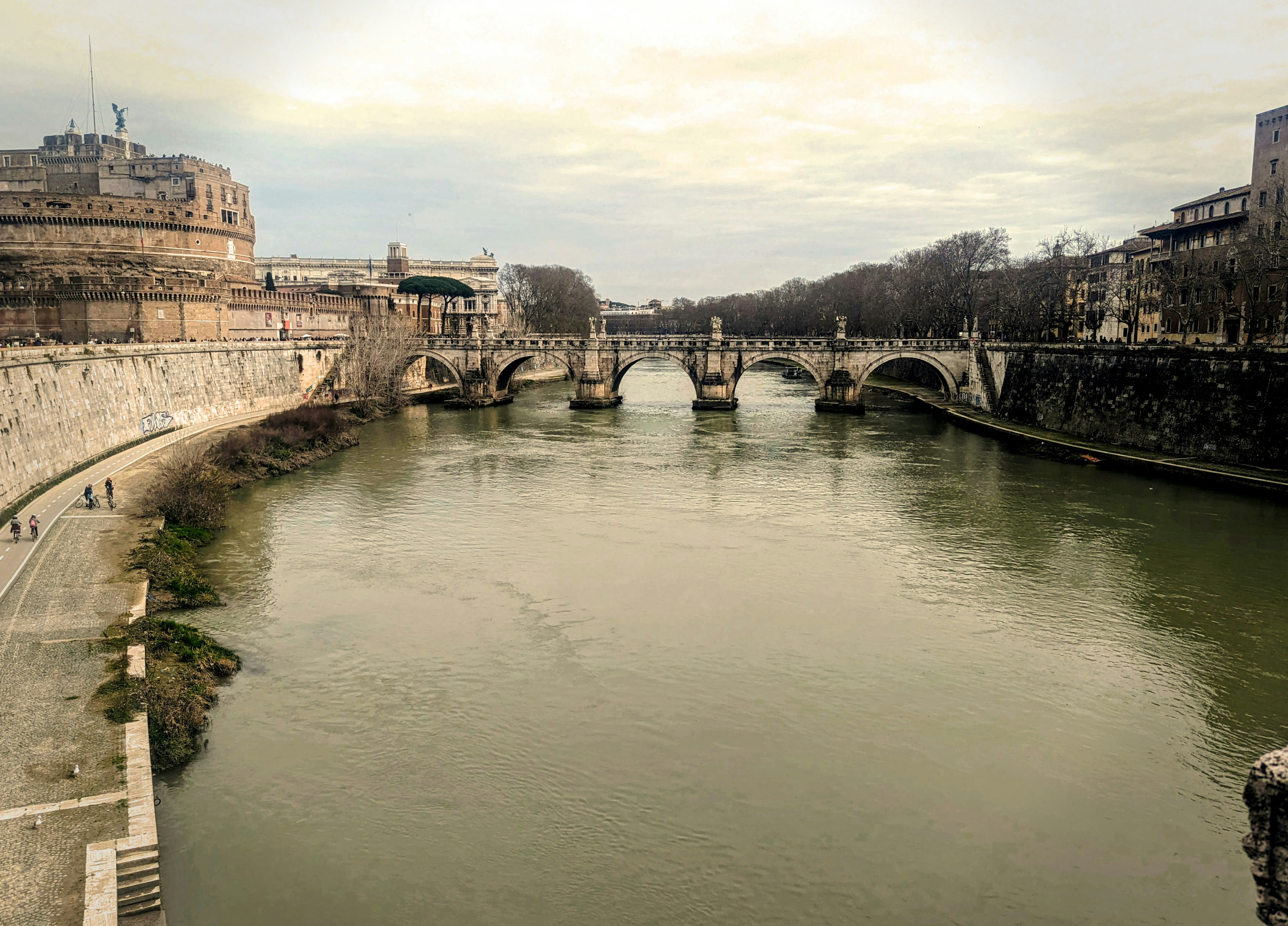 River Fortress: Rome's Tiber Edge and Ponte Sant’Angelo Silhouette