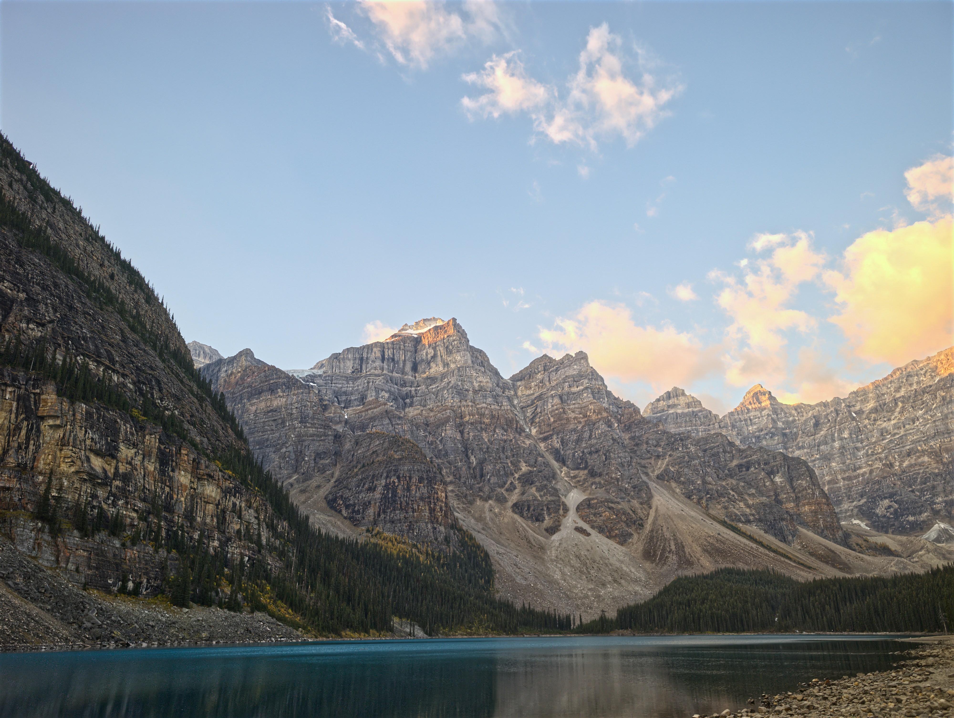 Sunlit Peaks Over a Serene Alpine Lake
