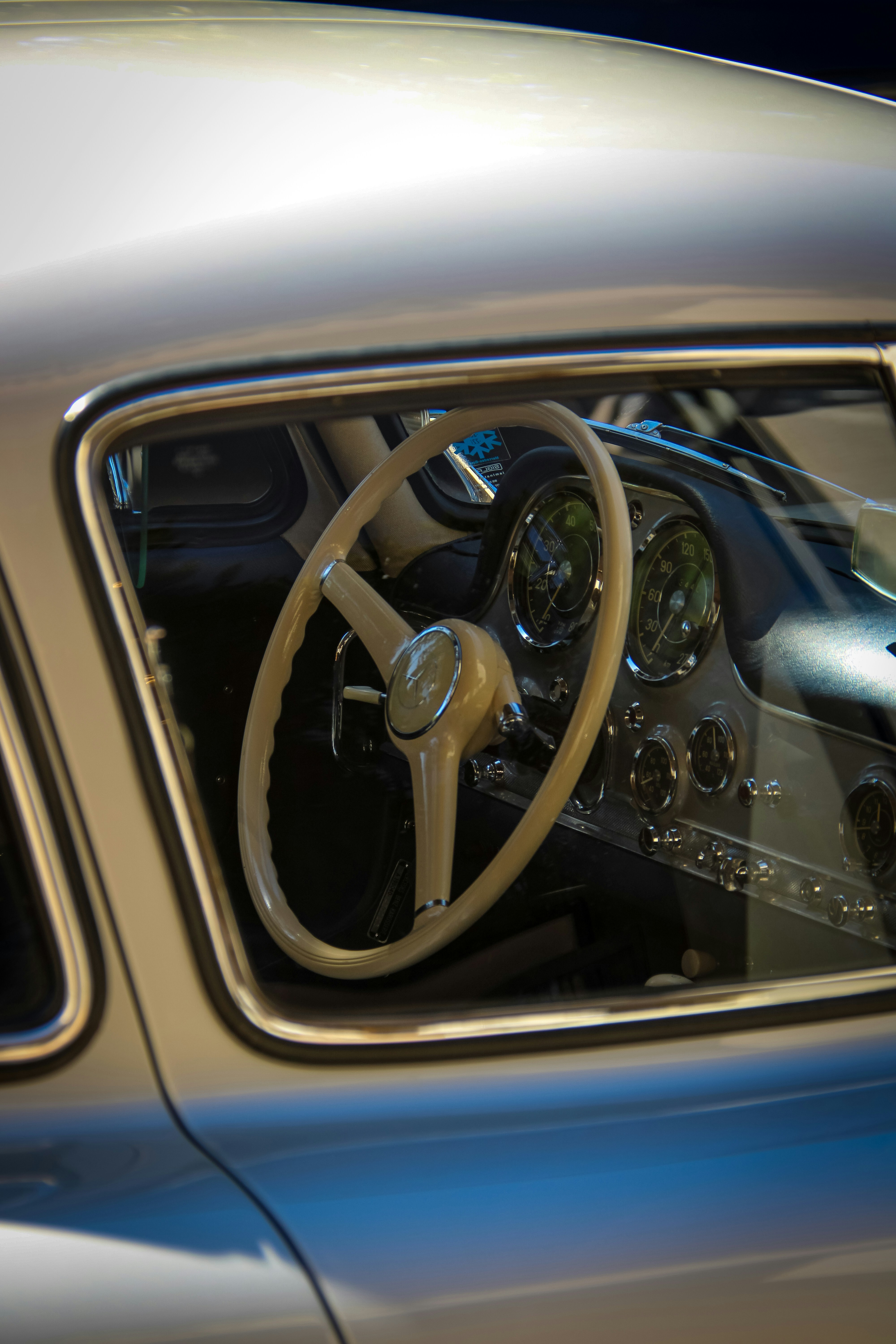 Classic Car Interior: Chrome Steering Wheel Meets Vintage Dashboard