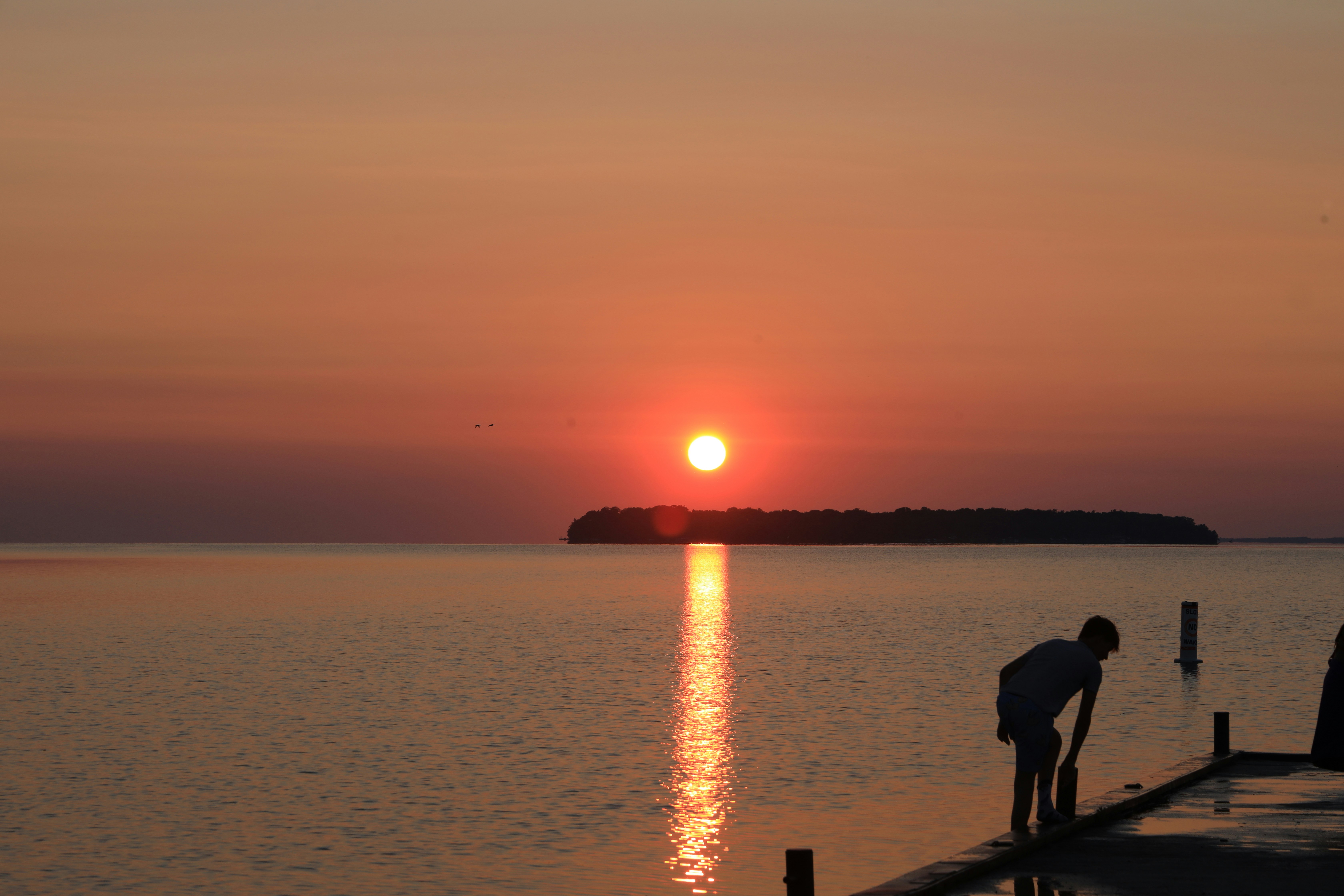 Sunset Silhouette at the End of the Dock