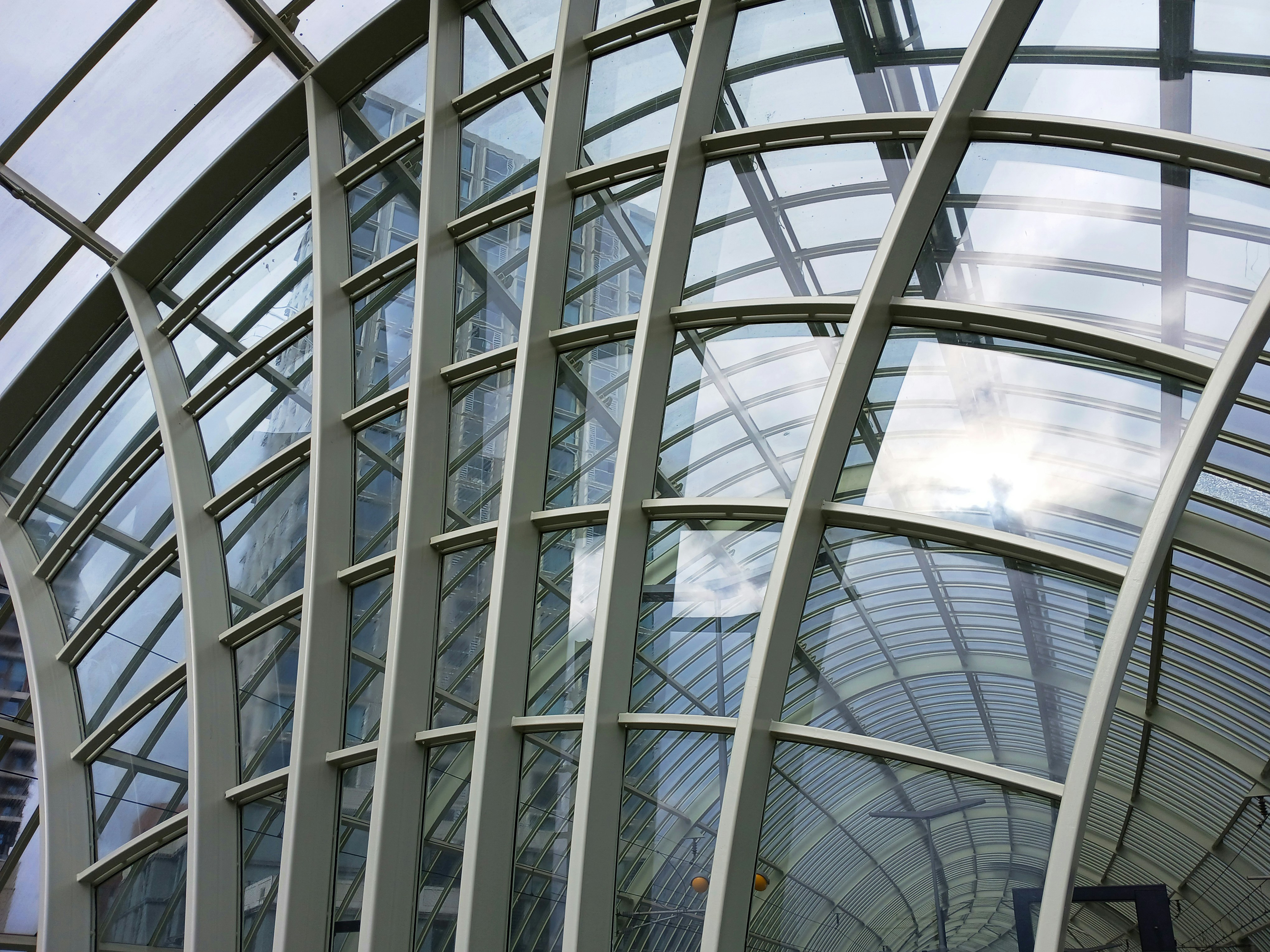 Curved Glass Skeleton: Light Through a Dome of Steel and Panes