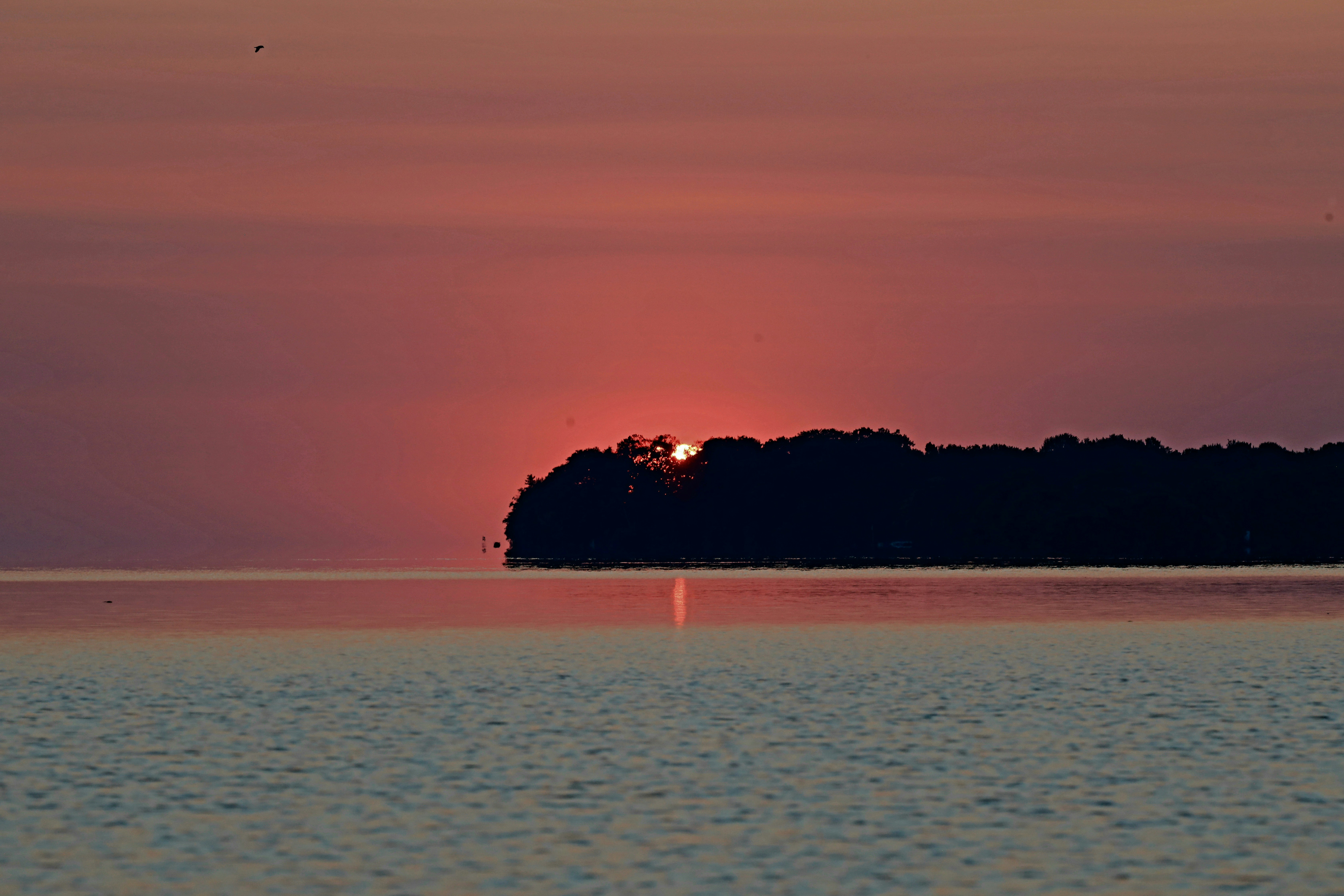 Sunset Sentinel: Silhouette Island at Dusk