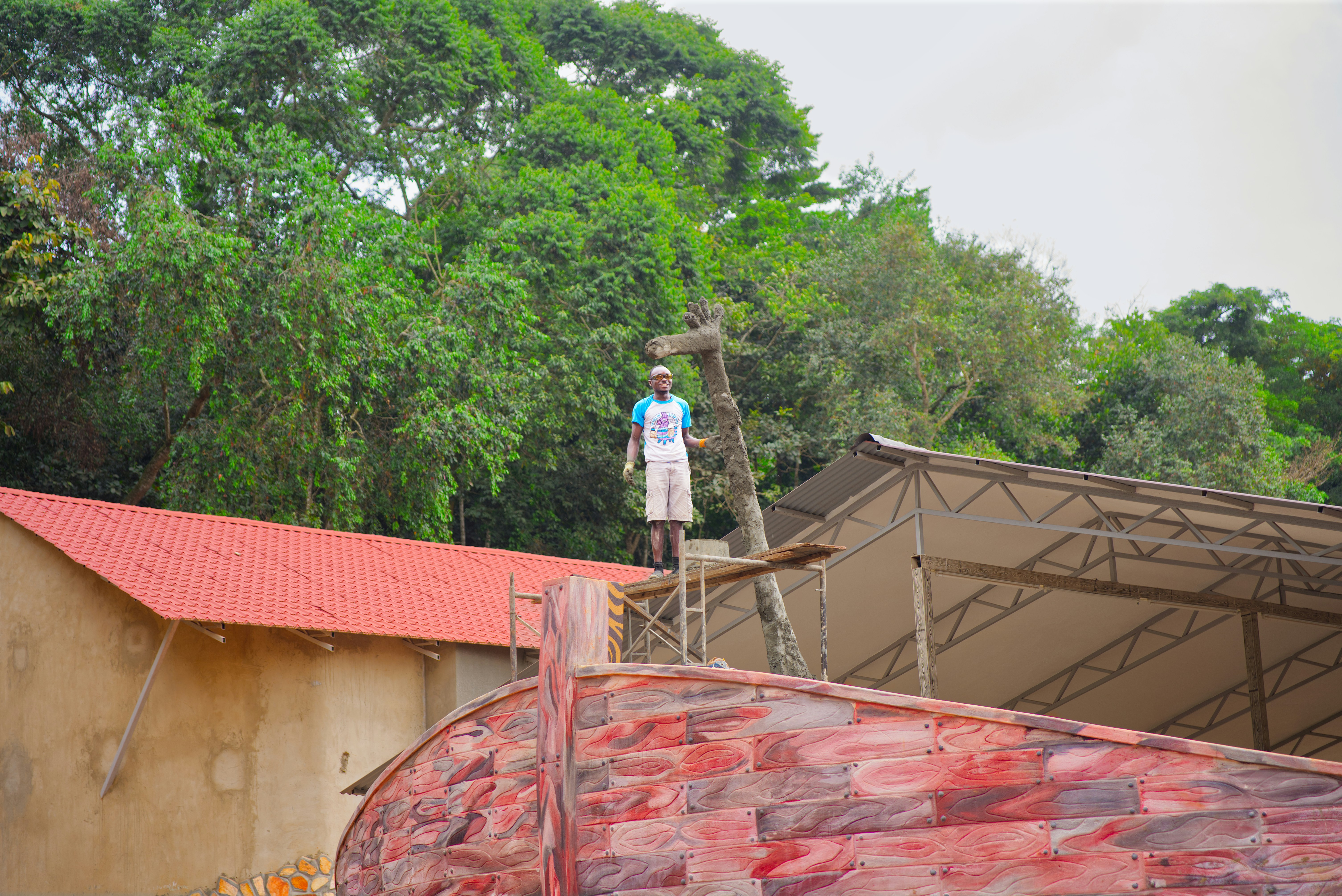 Lone Figure Amid Roofscapes: A Rooftop Perch