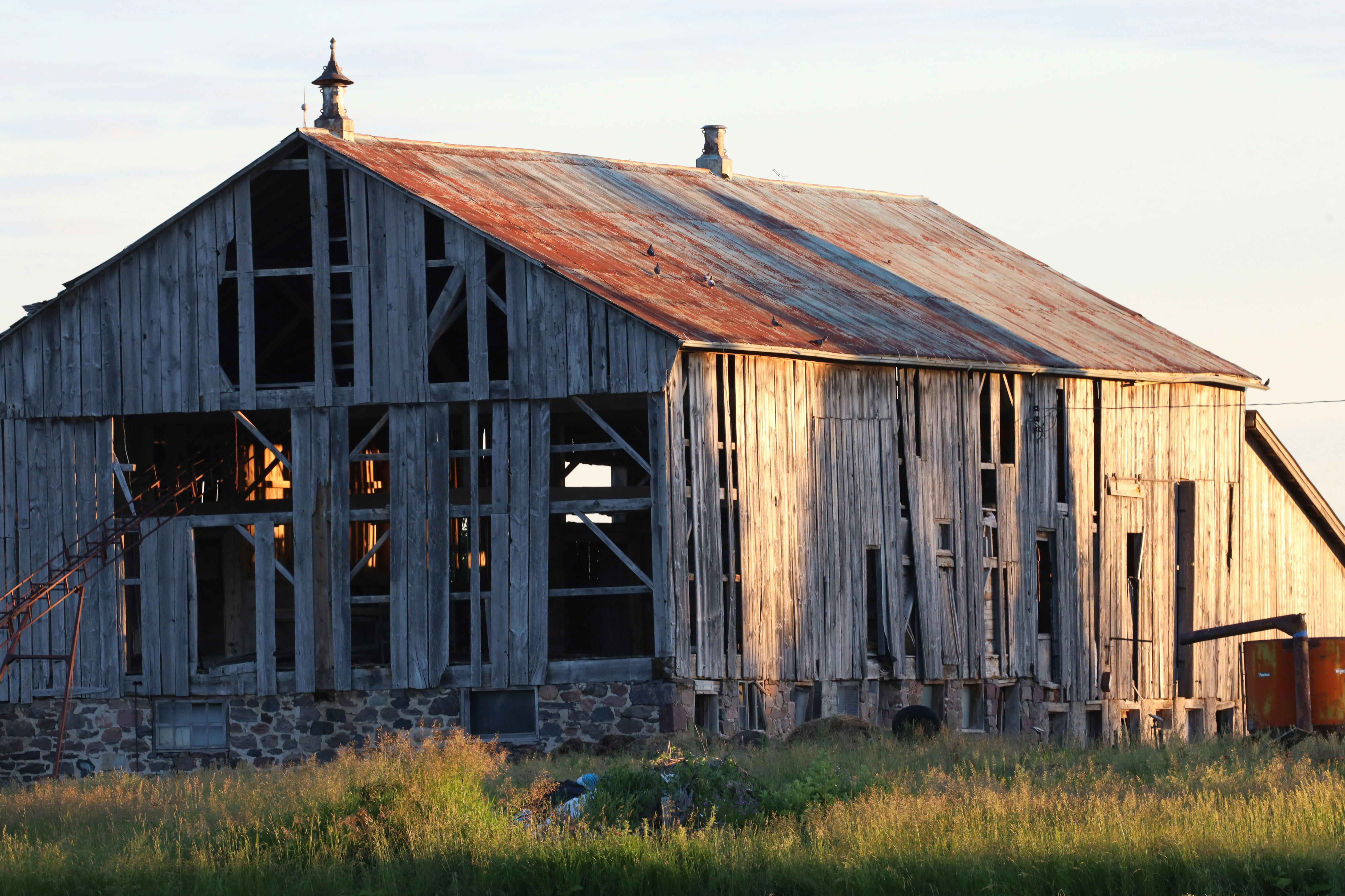 Weathered Barn at Dusk Over Open Field