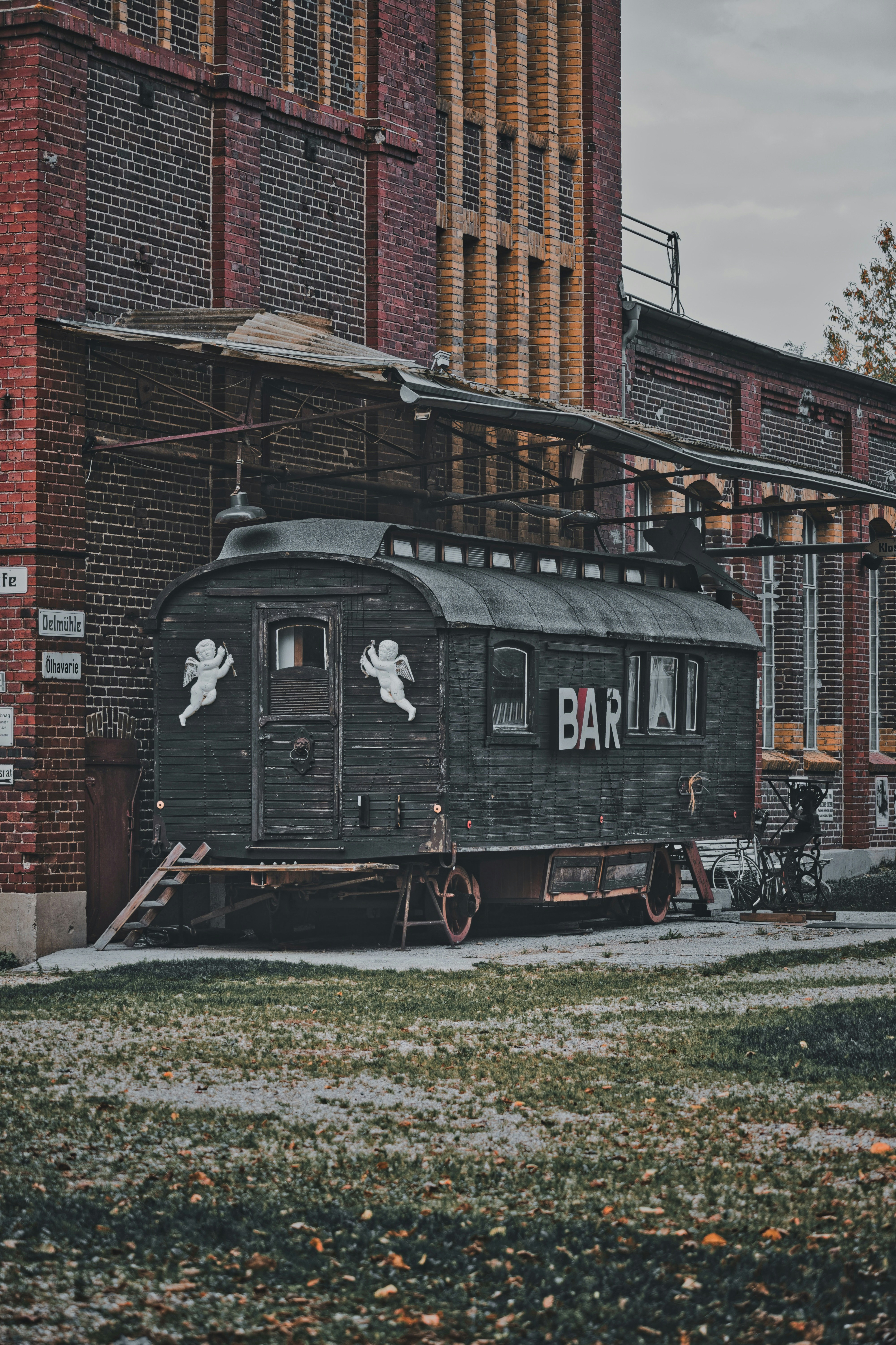 Old Railcar Bar in a Brick Campus at Dusk