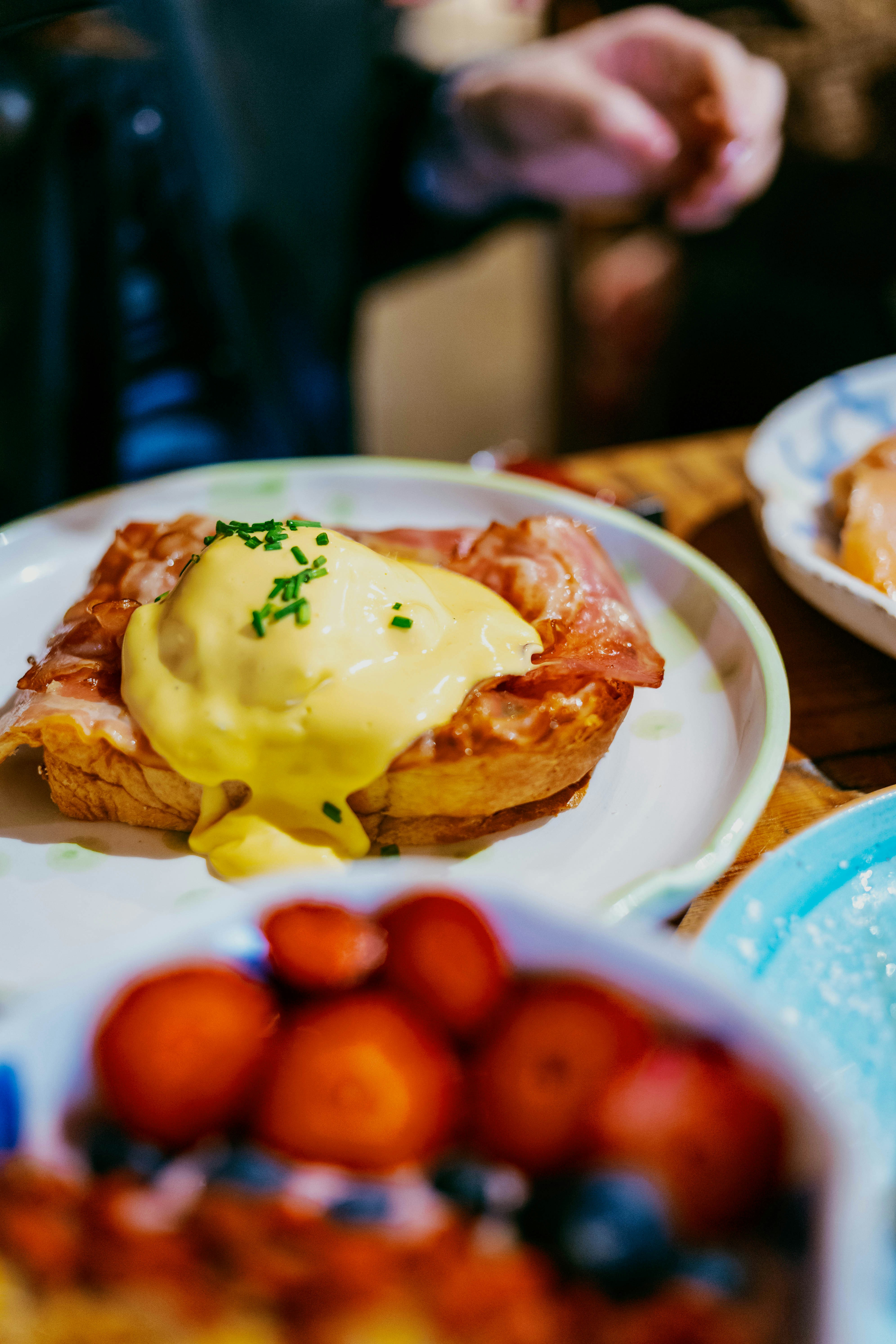 Creamy Egg Benedict Under Soft Dinner Lighting