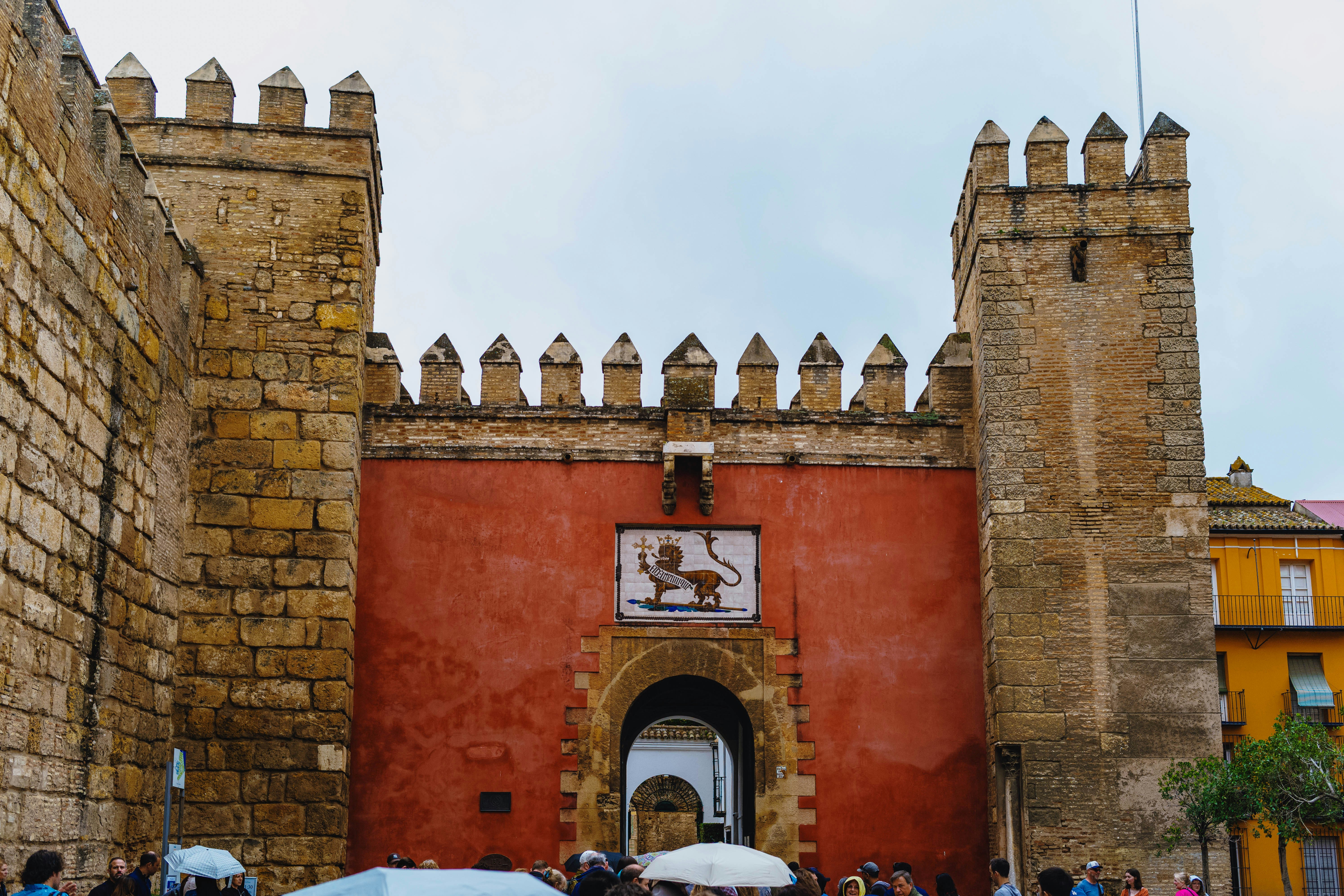 Gates of History: The Red Archway Framed by Medieval Turrets
