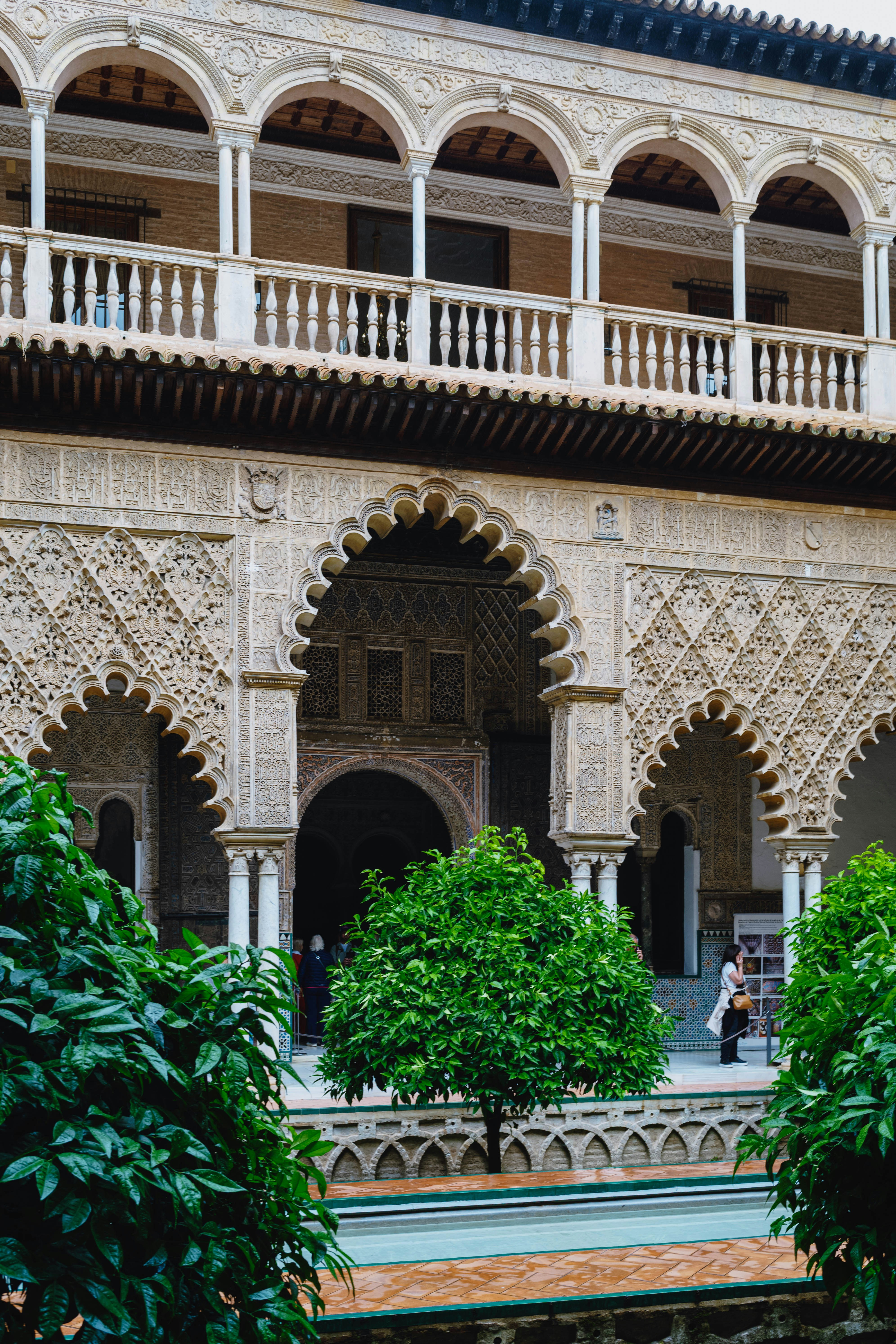 Ornate arches and lush courtyard: whispering arches of a Moorish courtyard