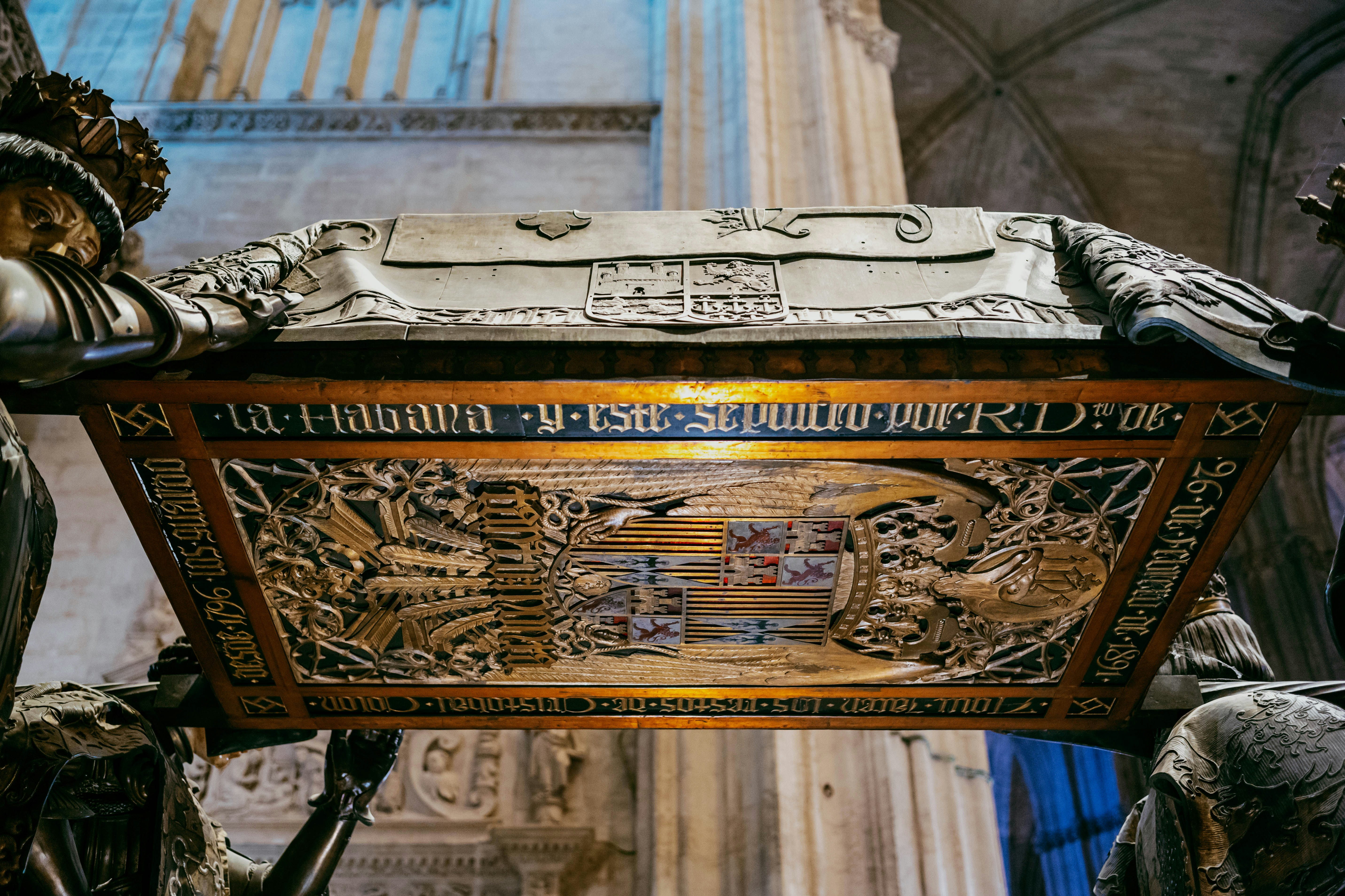 Ornate Chest of Armorial Carvings Elevates the Cathedral Ambience