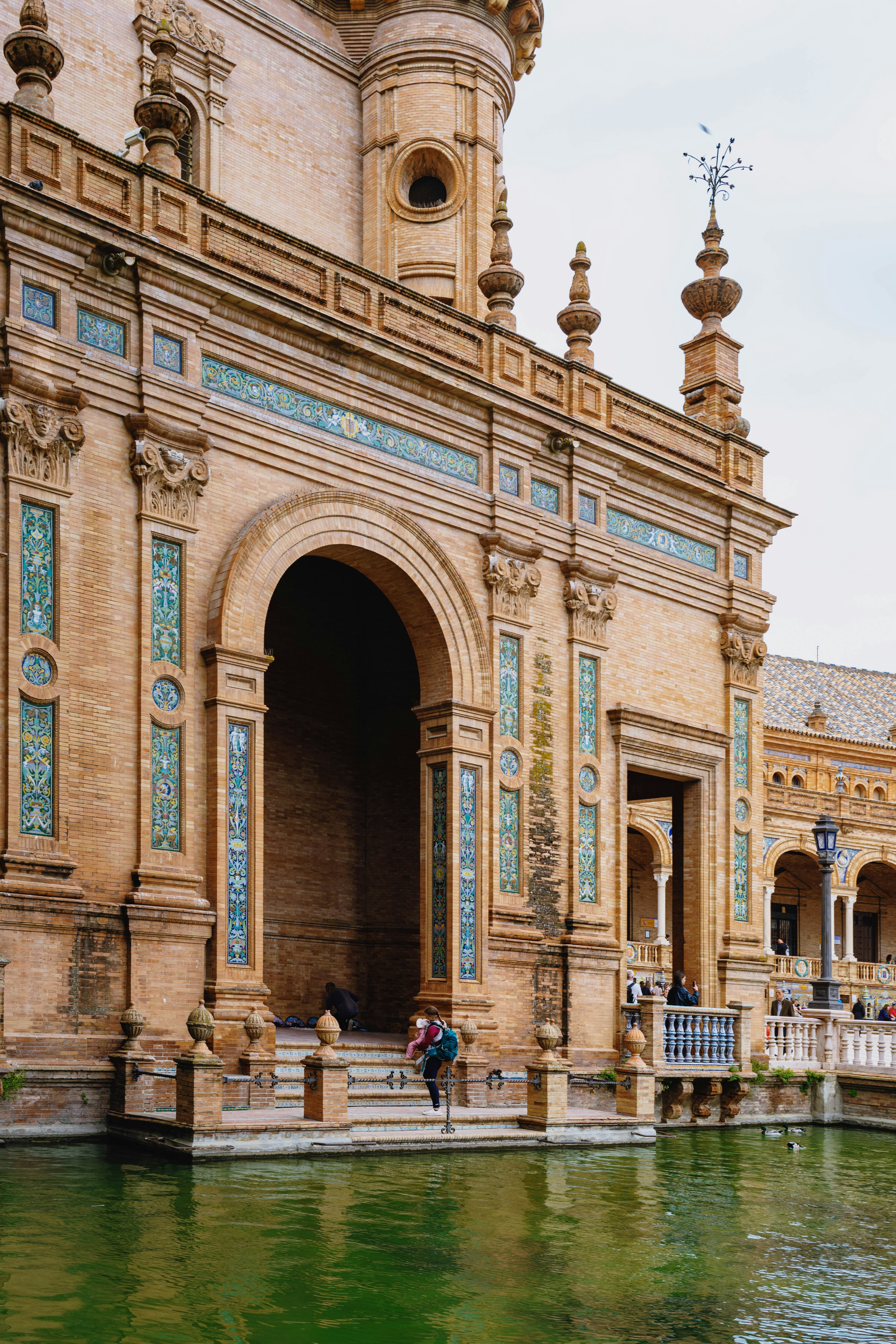 Ornate Gateway by the Water: Andalusian Revival Courtyard