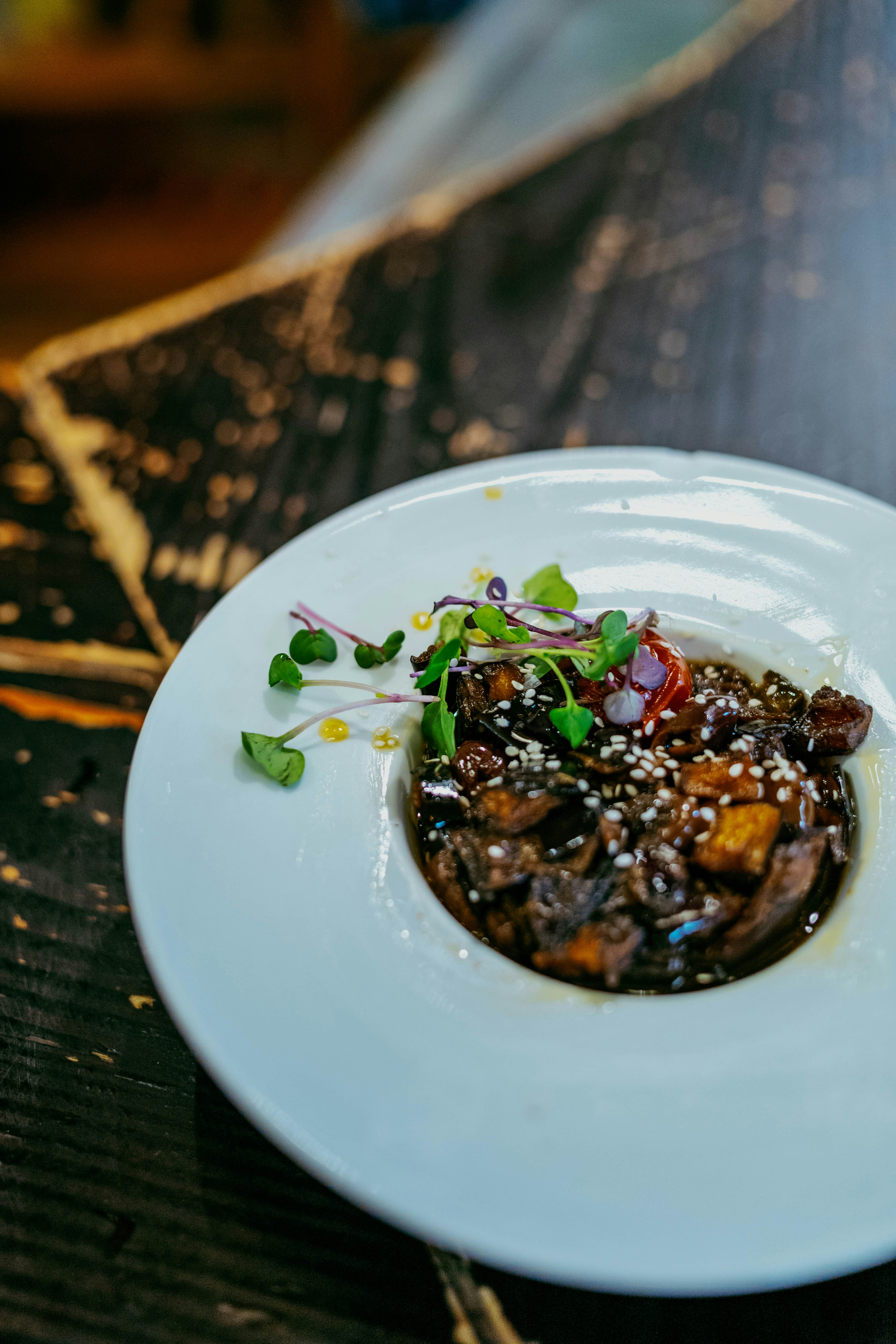 Midnight Glaze: A Plate of Caramel-Soaked Mushrooms with Microgreens