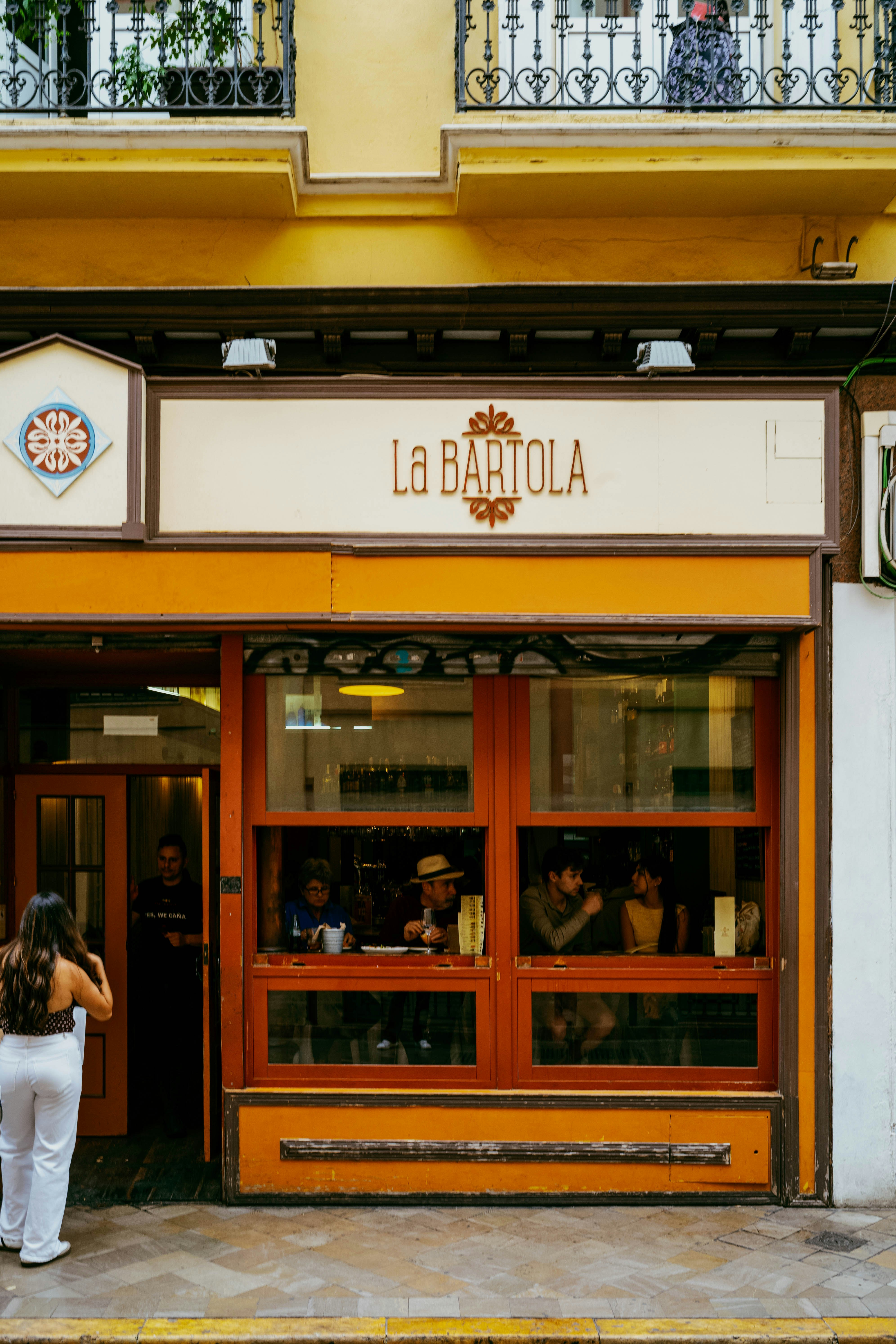 Cafe La Bartola: A Golden-Faced Window into Streetlife