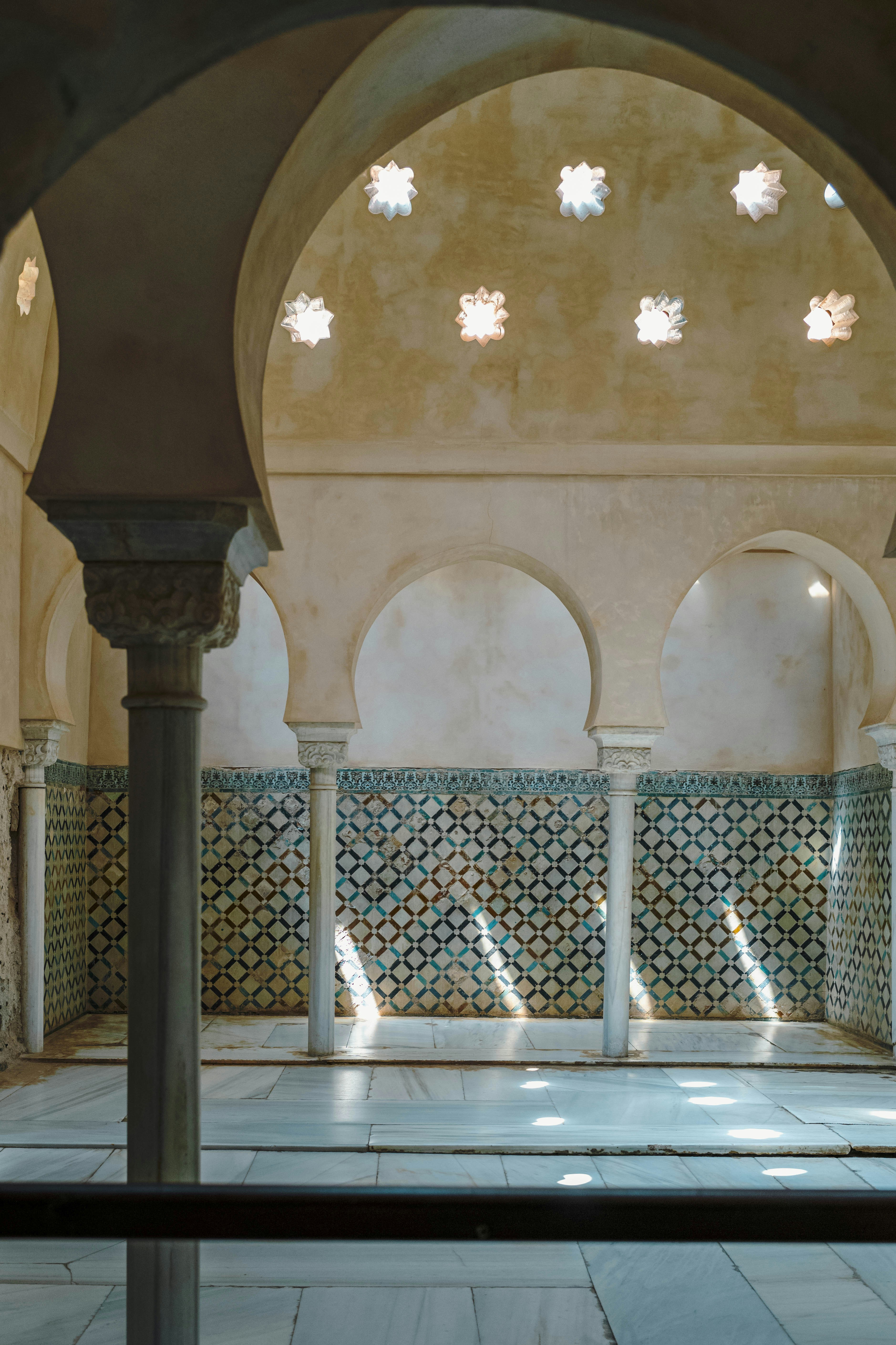 Arcaded Courtyard with Dappled Light and Moorish Tilework