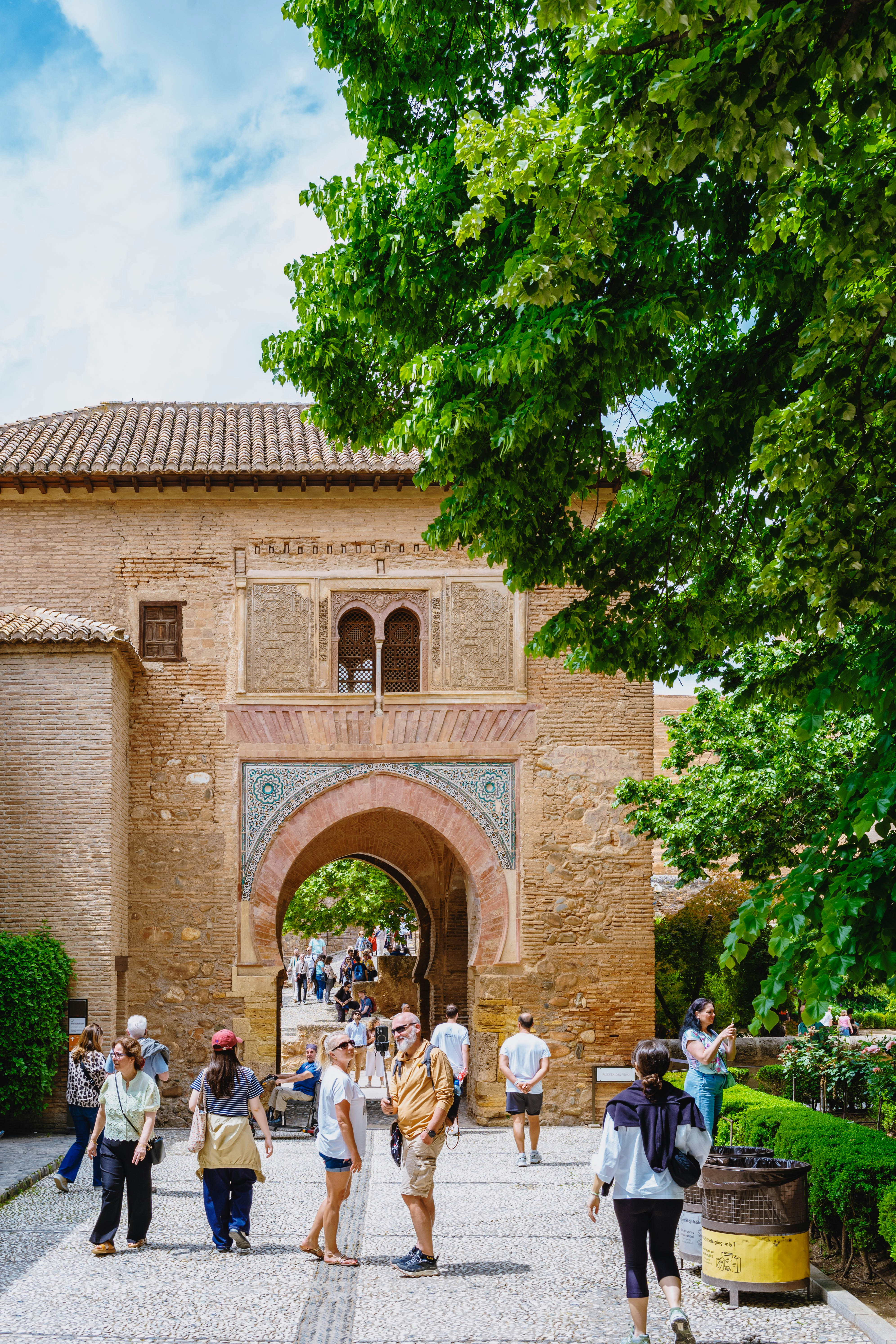 Gateway to the Piazza: Arched Entrance Framed by a Lush Canopy