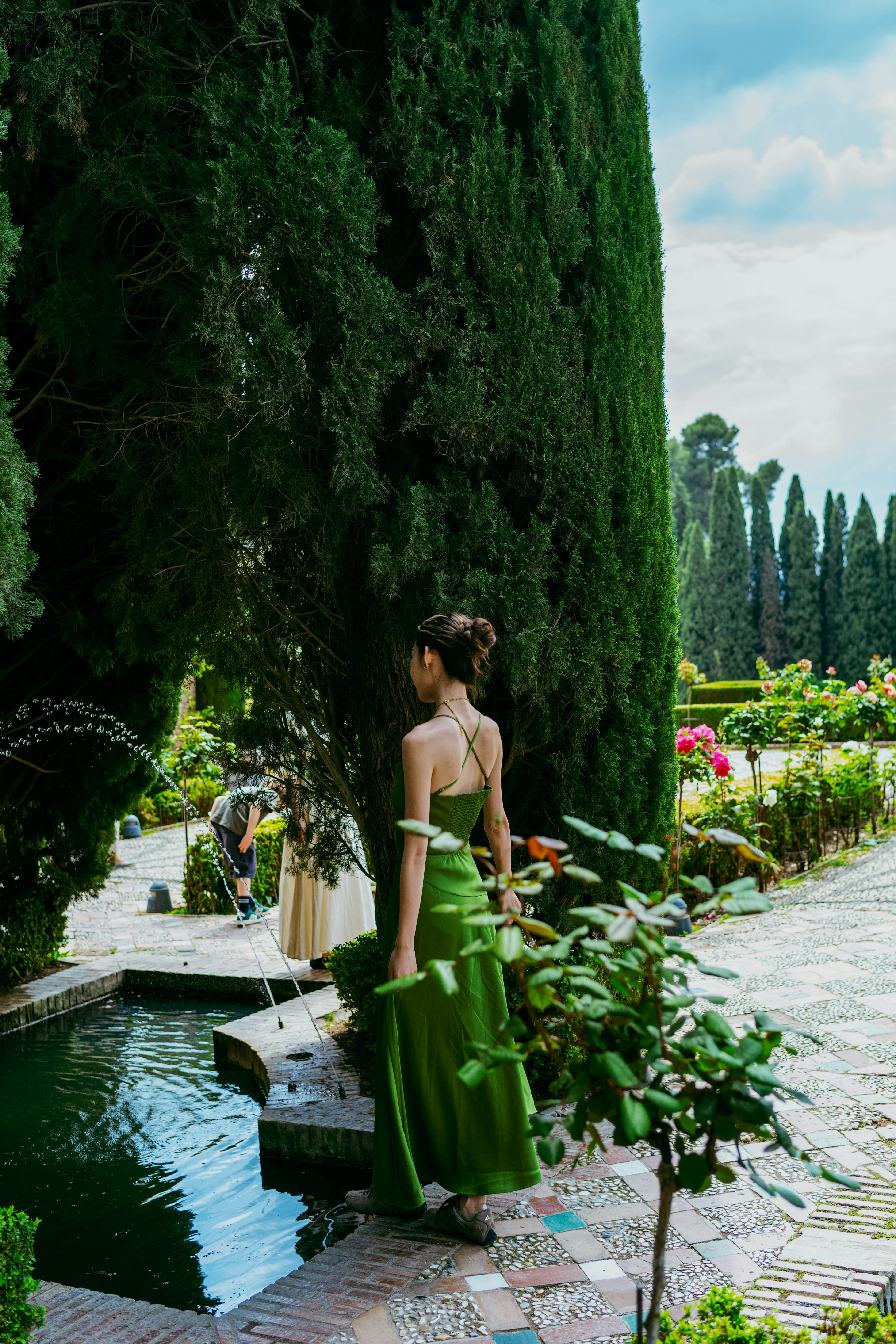Emerald Gown in the Garden of Tall Cypress
