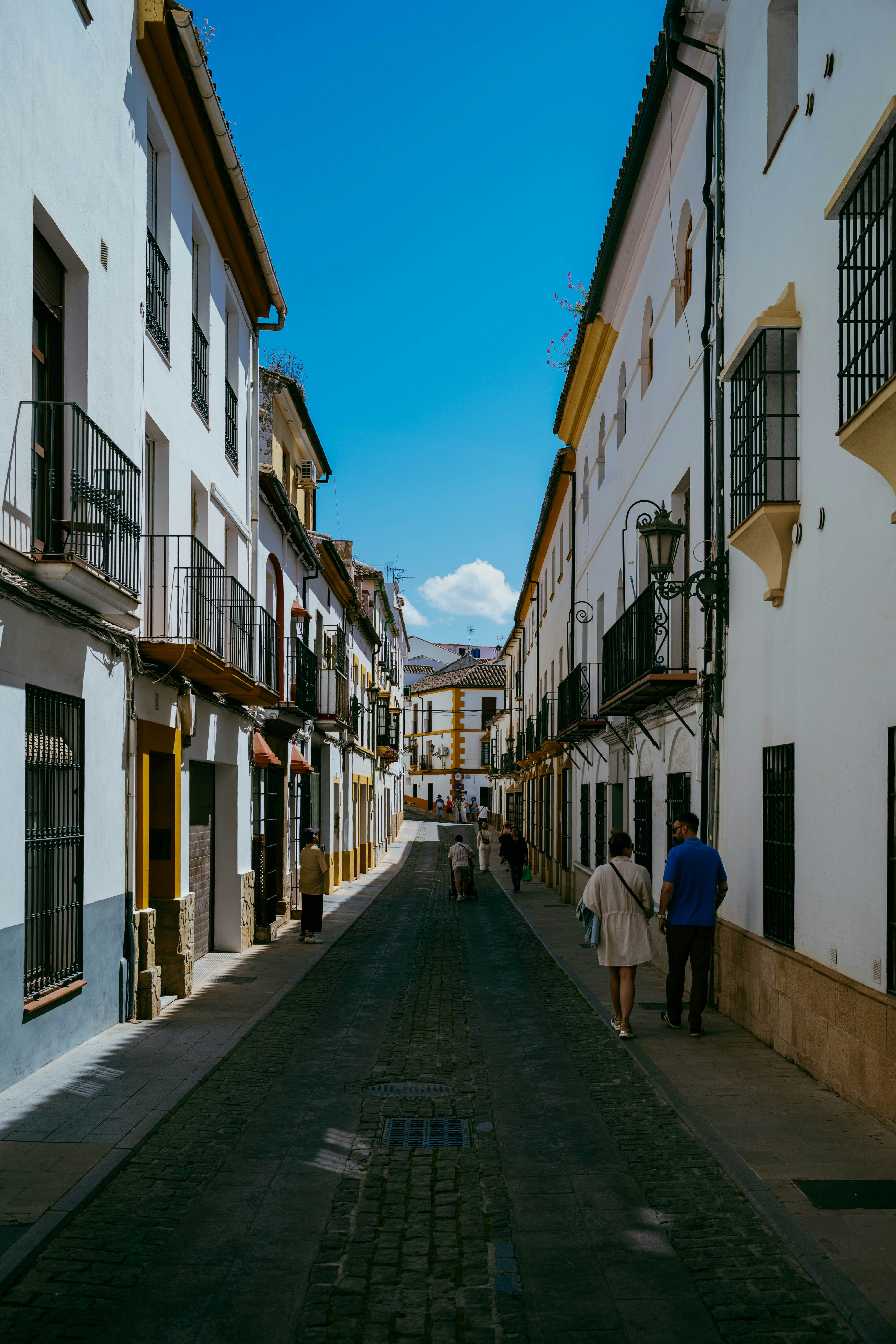 Sunlit Calle of Oranges: A Narrow Seville-esque Walk