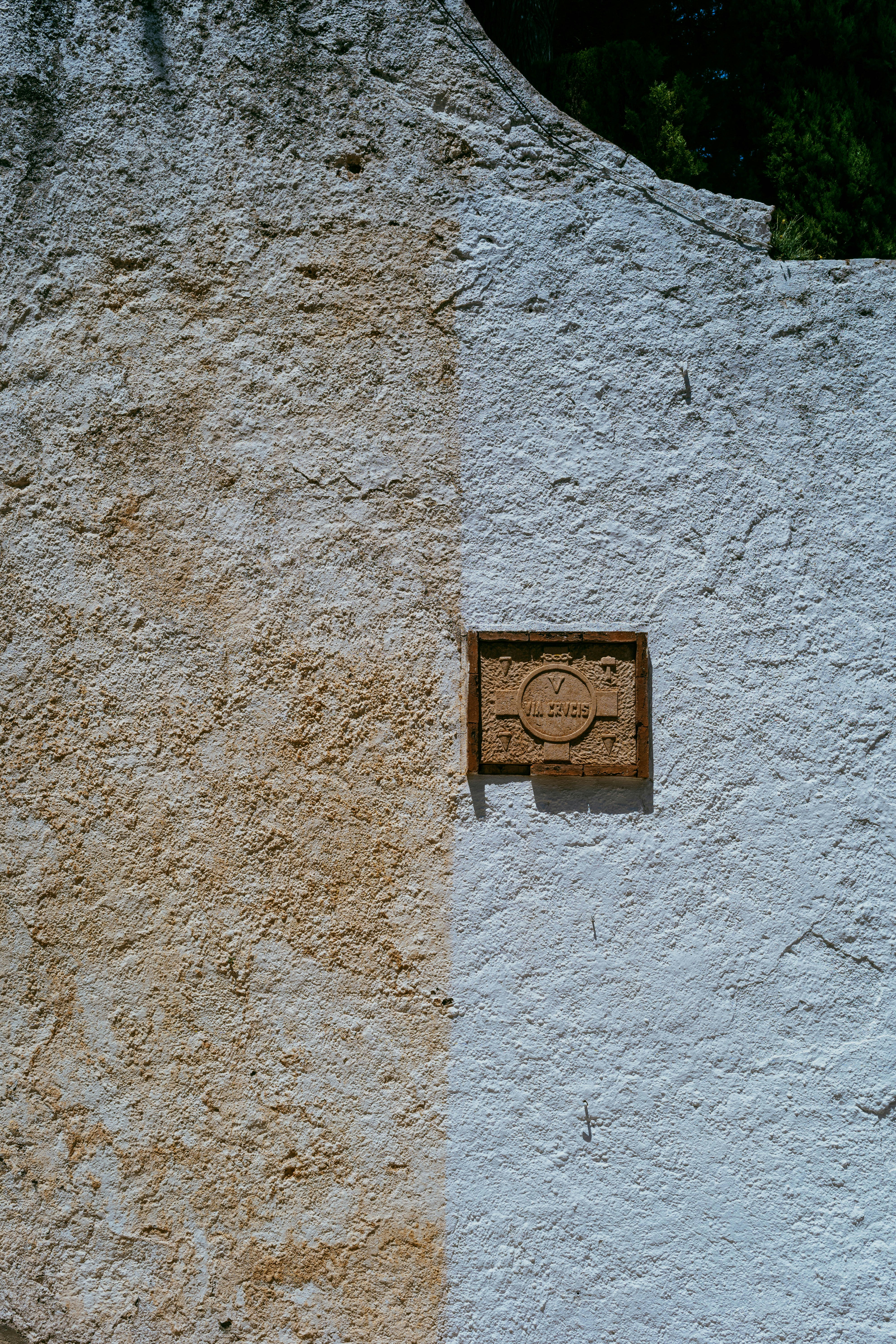 Two-Toned Wall with a Central Emblem