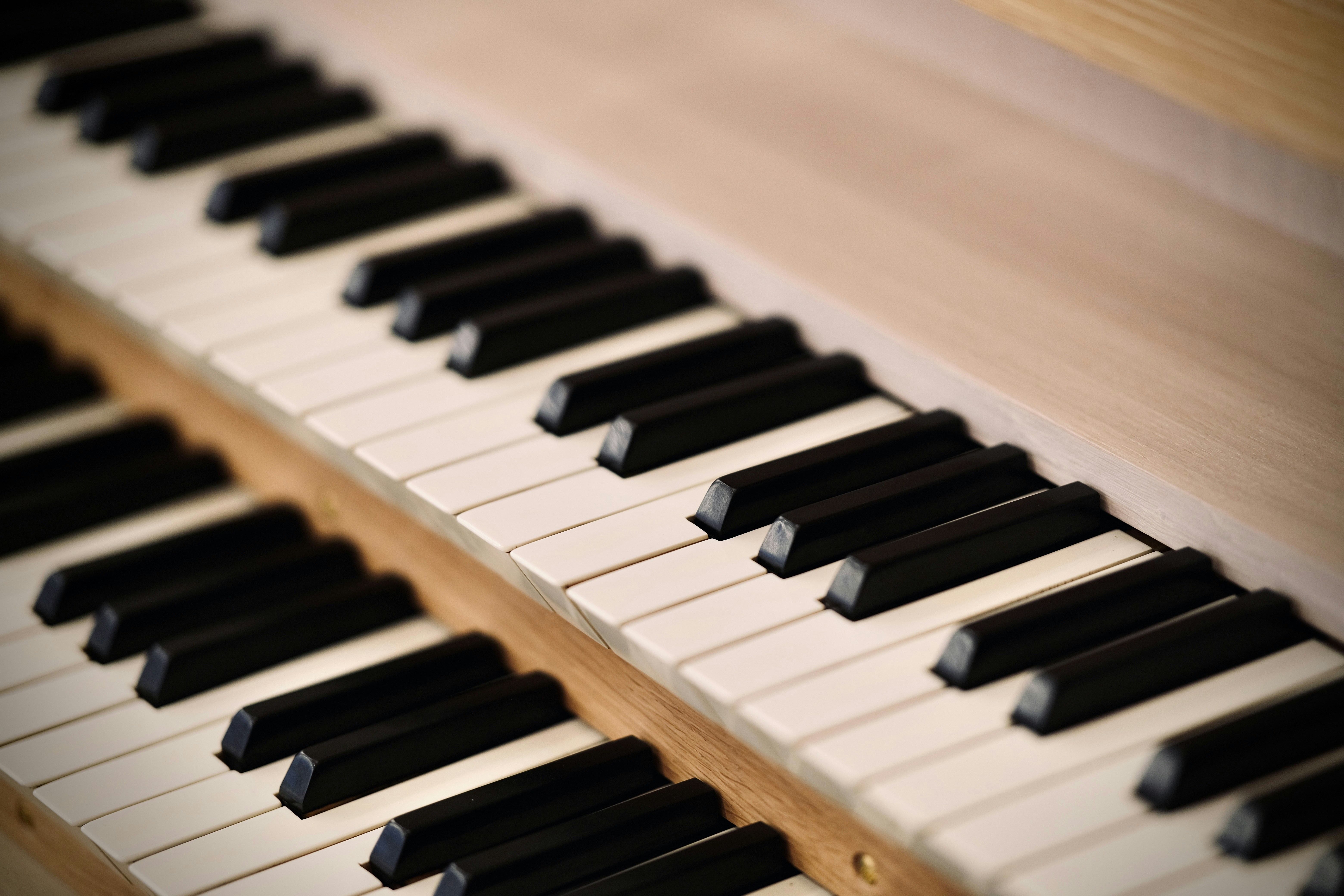 Row of piano keys in soft focus with receding perspective
