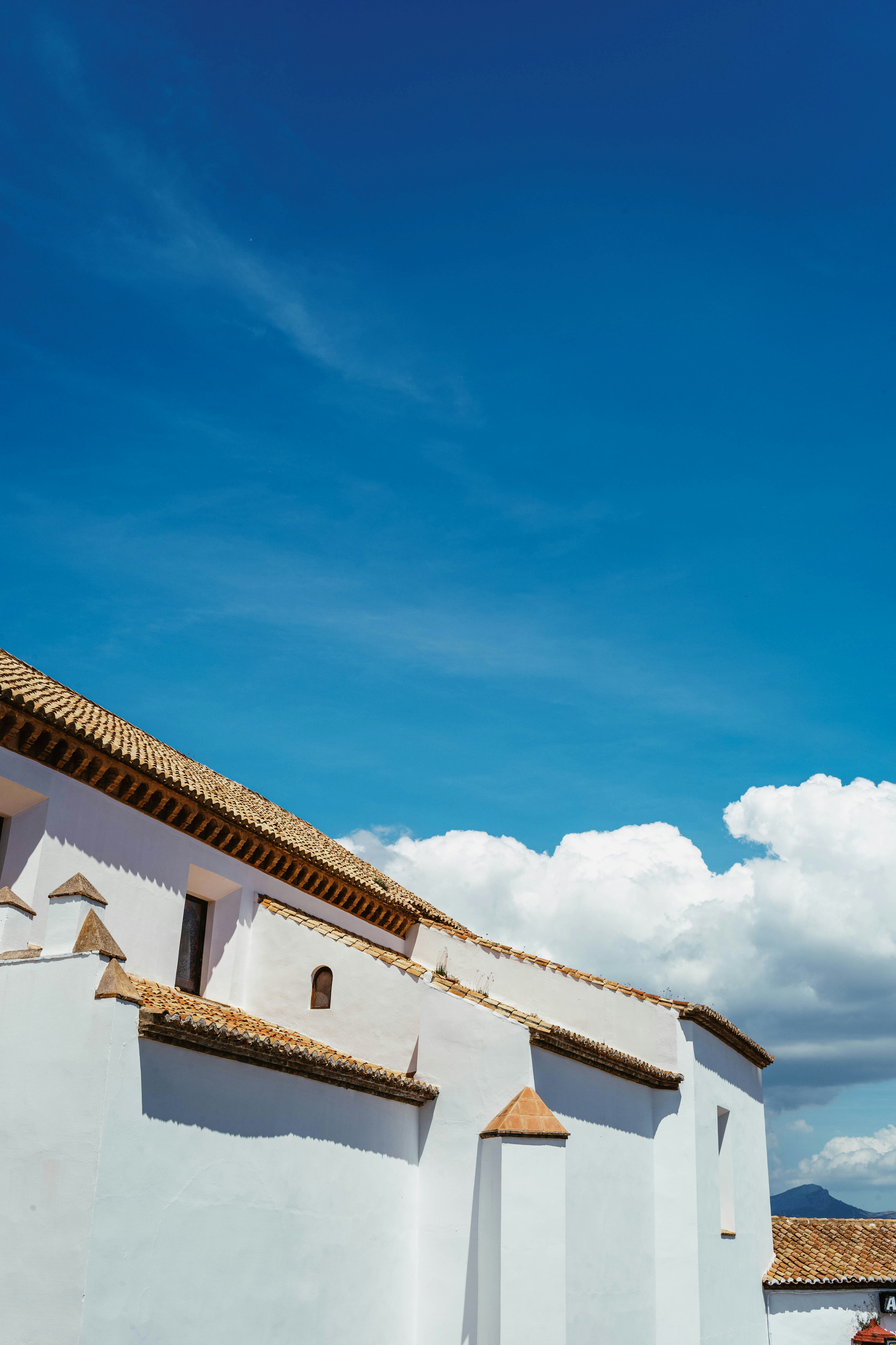 Whitewashed Mediterranean Facades Under a Wide Blue Sky