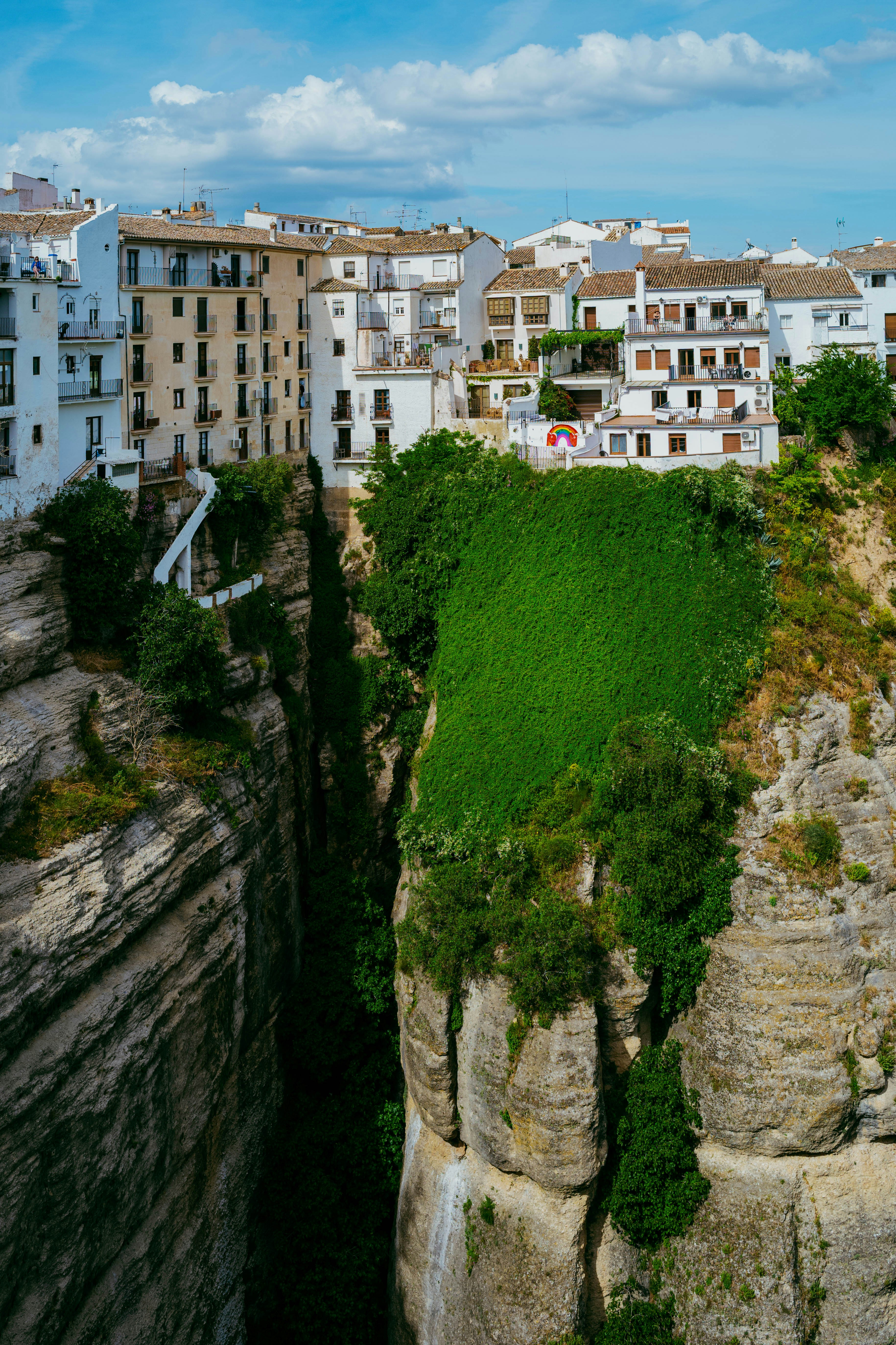 Cliffside Village: Whitewashed Homes Perched Above a Verdant Drop