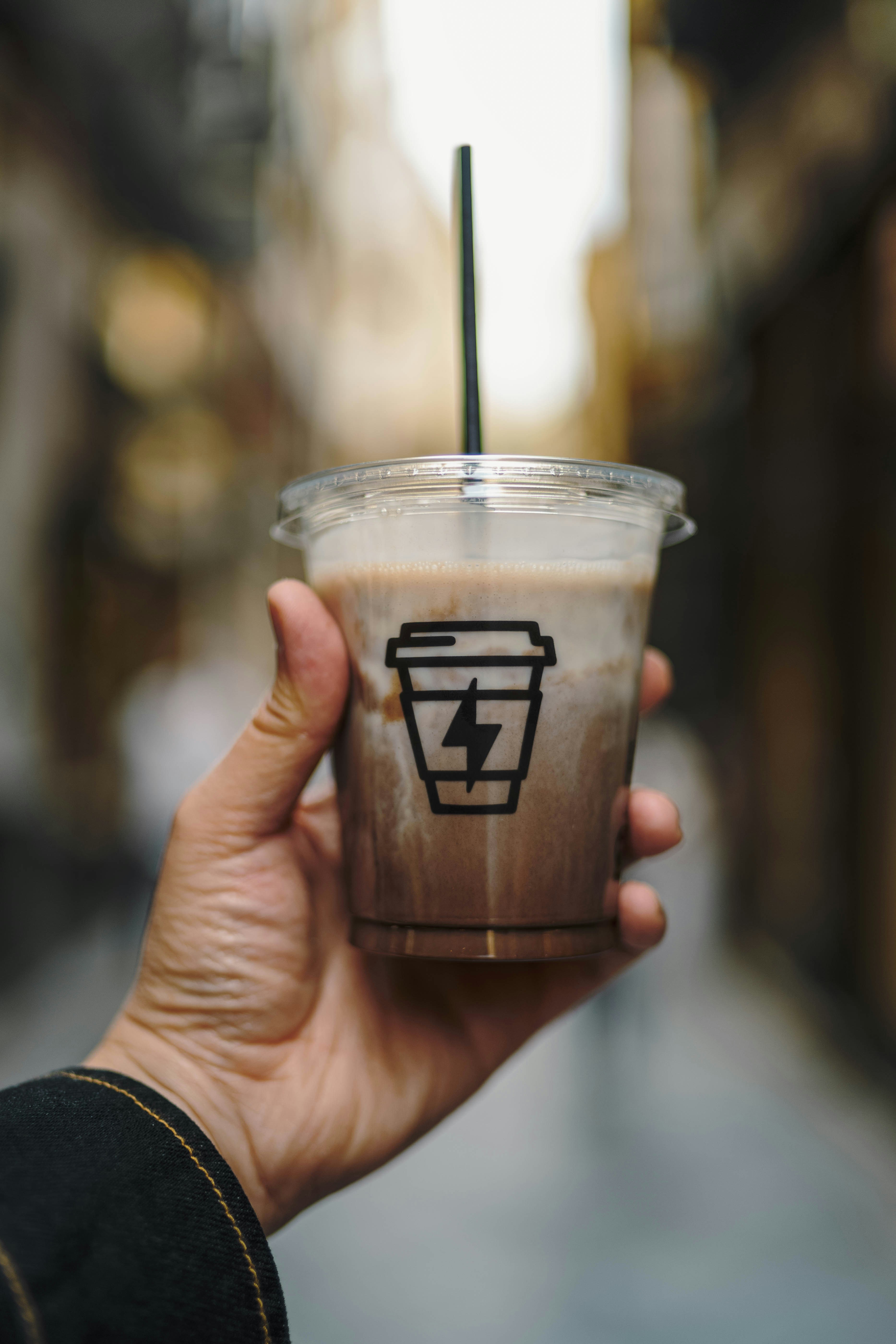 Handheld Cup of Cold Brew: A Urban Coffee Moment